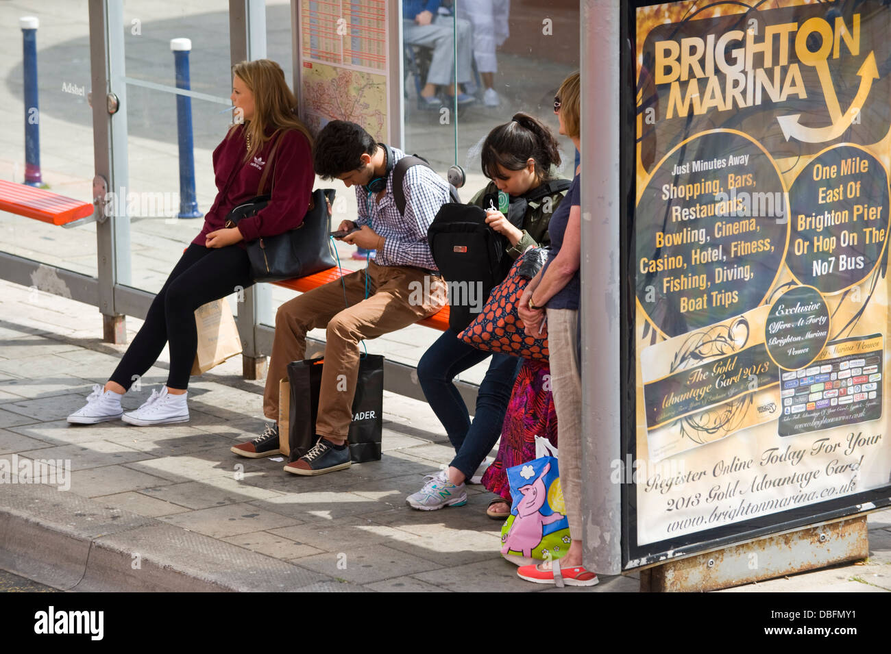 Bus shelter advertising crowd hi-res stock photography and images - Alamy