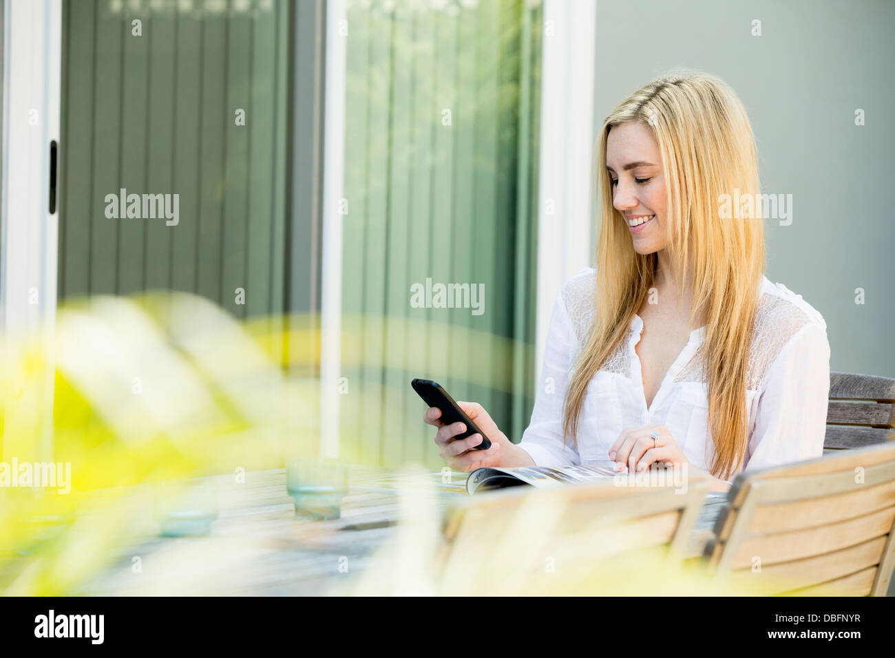 Caucasian woman using cell phone outdoors Stock Photo - Alamy