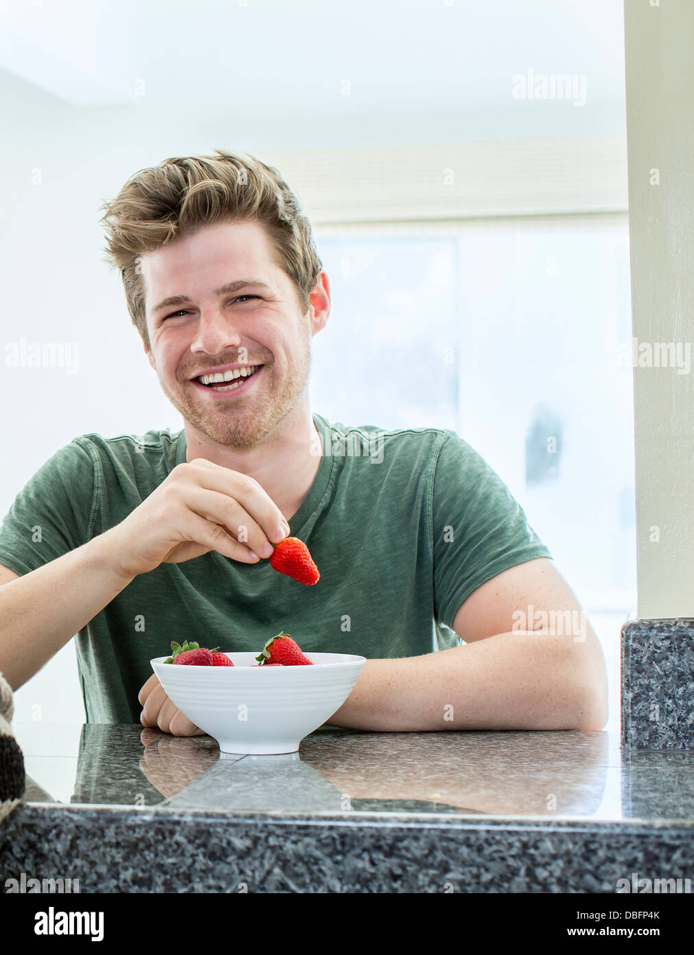 Man eating strawberries hi-res stock photography and images - Alamy