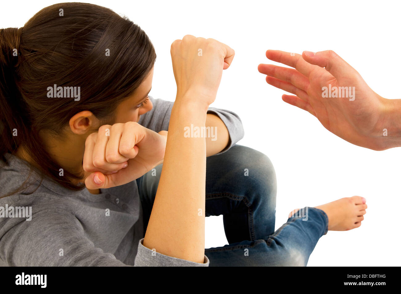teenage girl protect herself with arms crossed in front of face Stock ...