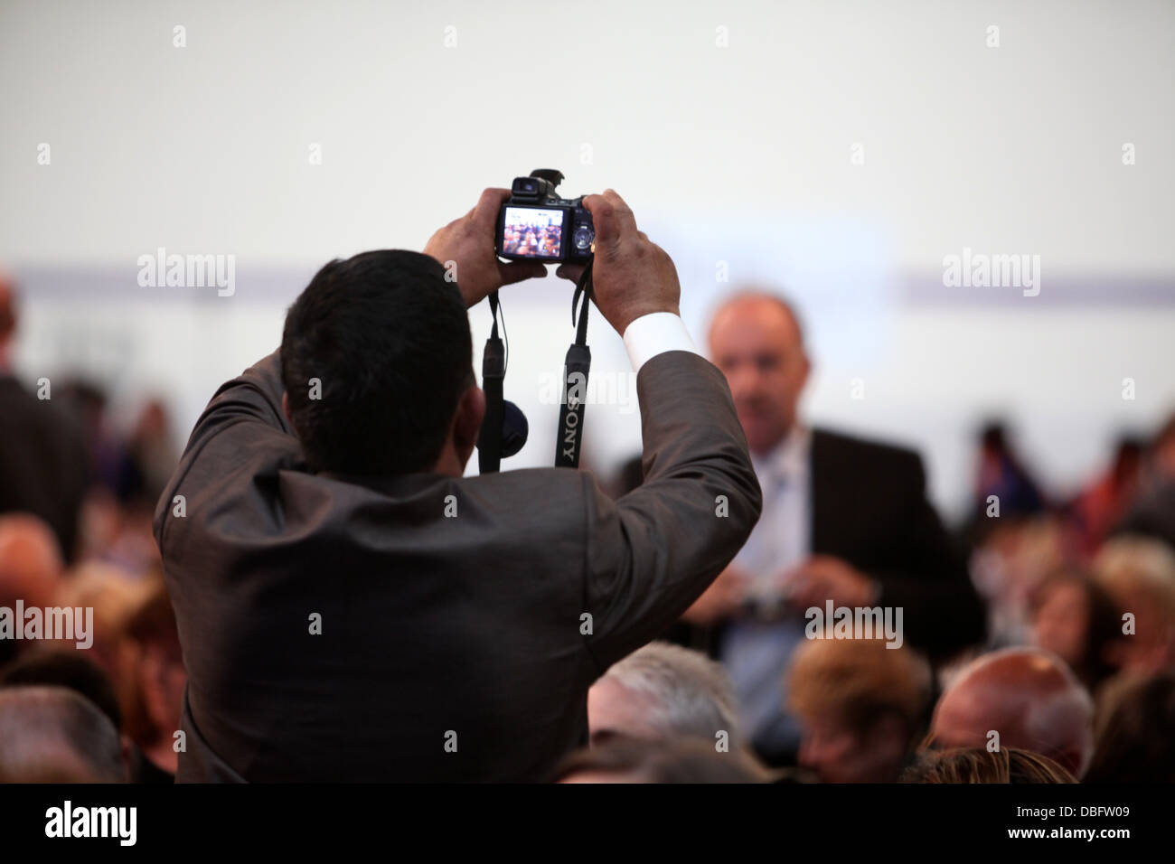 man using camera to capture graduation ceremony Stock Photo - Alamy