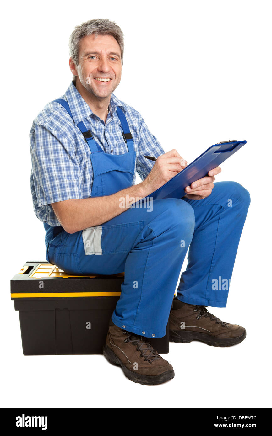 Confident service man taking notes Stock Photo - Alamy