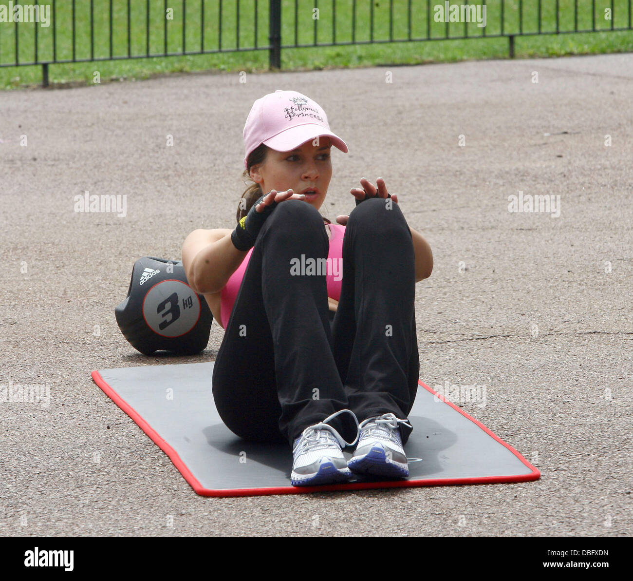 Imogen Thomas works out in a park with her personal trainer London ...