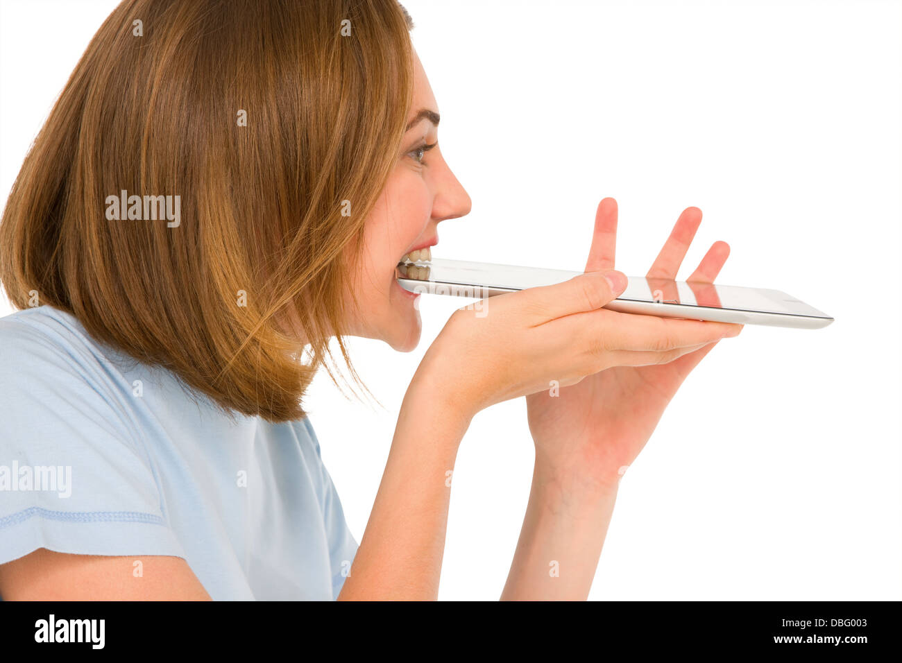 teenage girl with tablet in mouth Stock Photo - Alamy