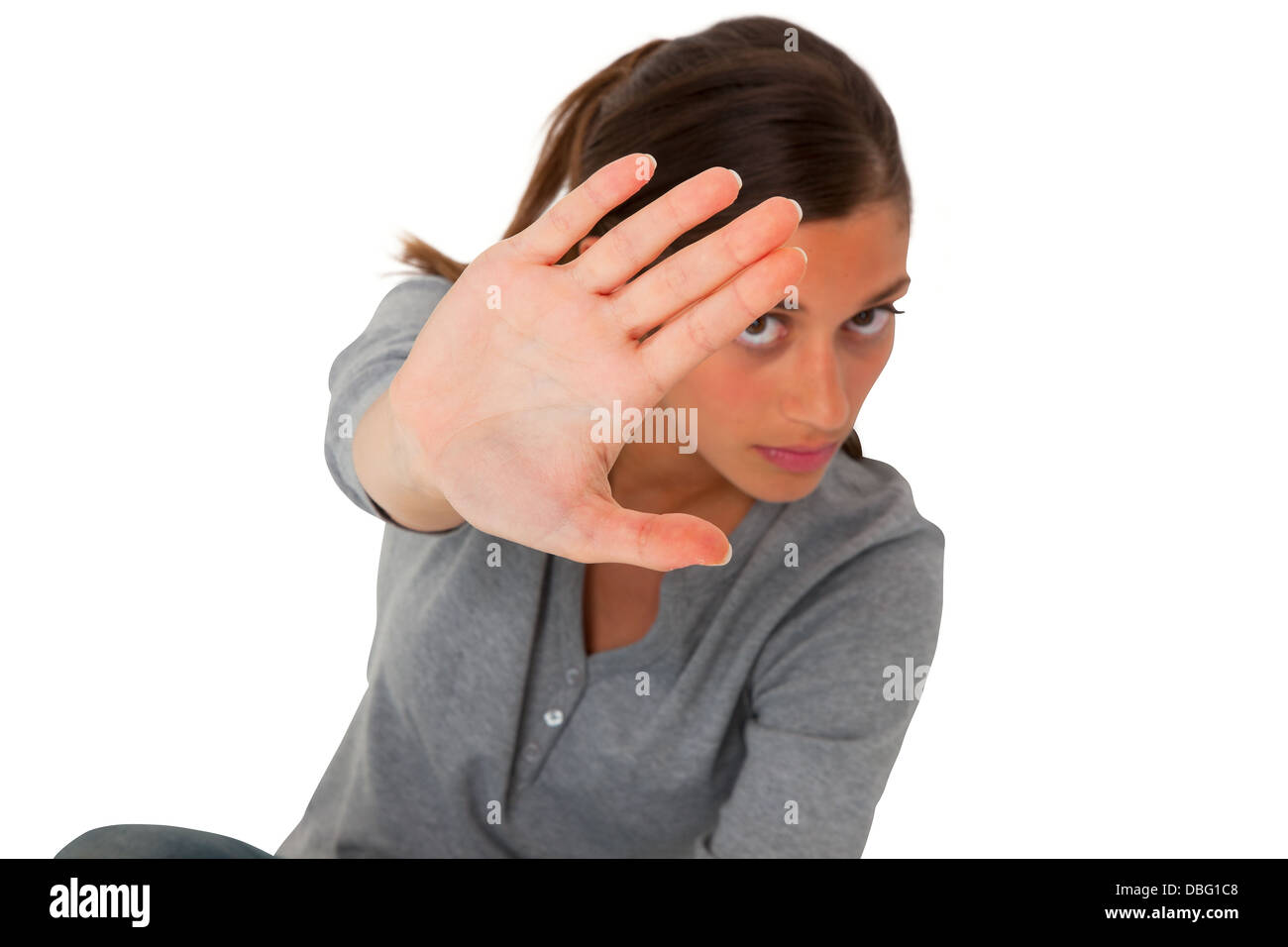 teenage girl holding hand up to block violence Stock Photo - Alamy