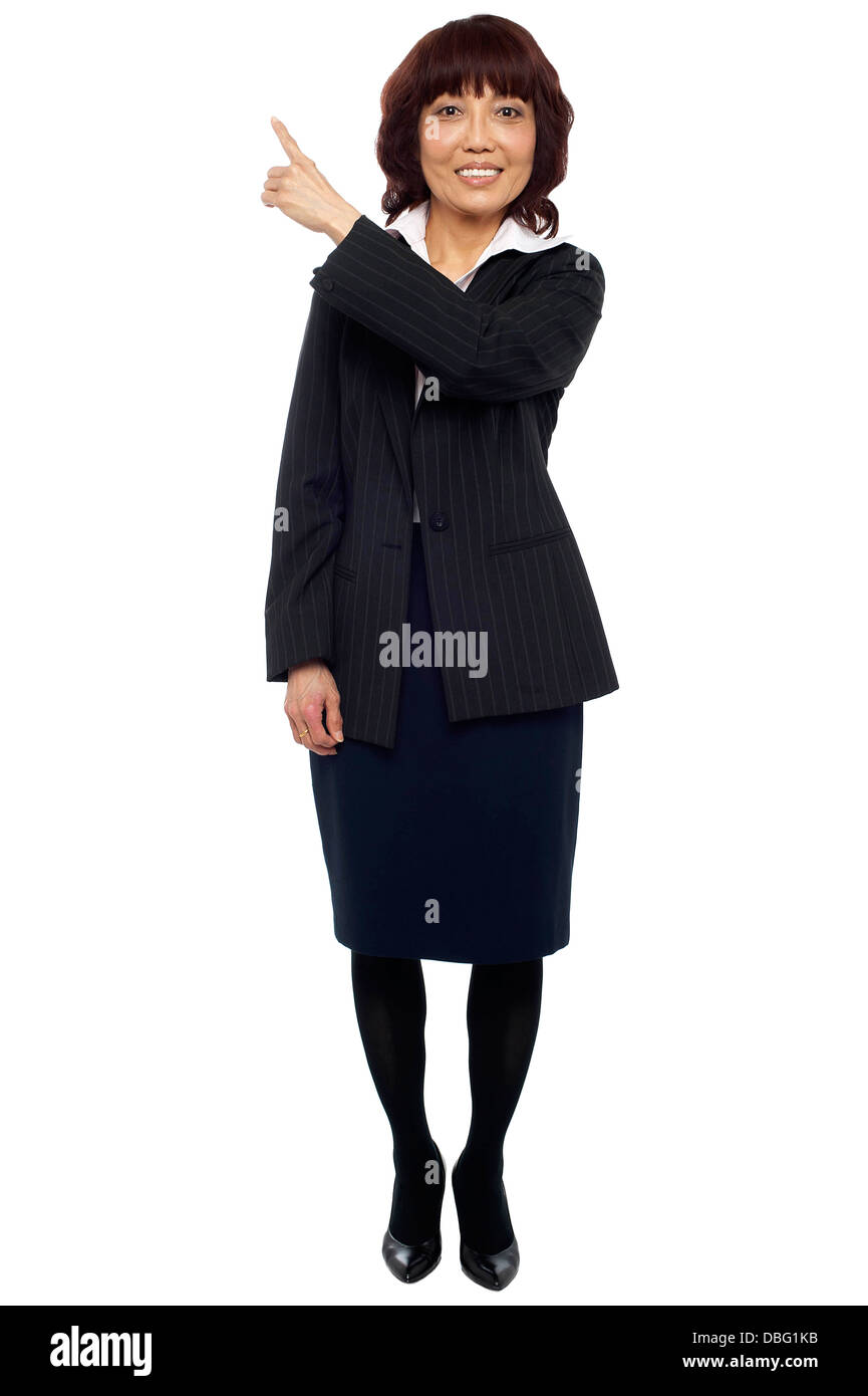 Female representative pointing at copy space area Stock Photo - Alamy