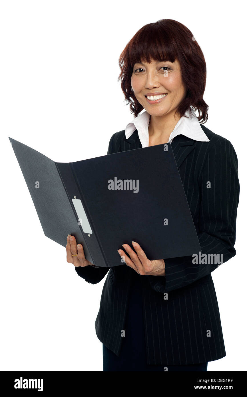 Secretary holding opened binder, smiling Stock Photo - Alamy