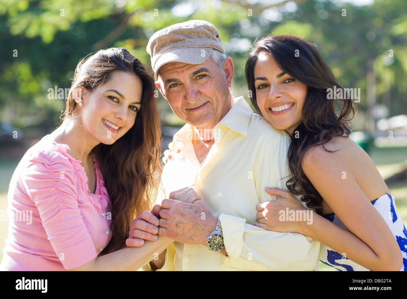 Hispanic father and daughters smiling outdoors Stock Photo - Alamy
