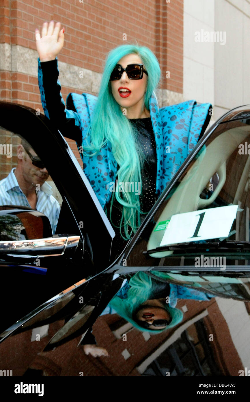 Lady Gaga greets and poses for pictures with fans at her hotel before ...