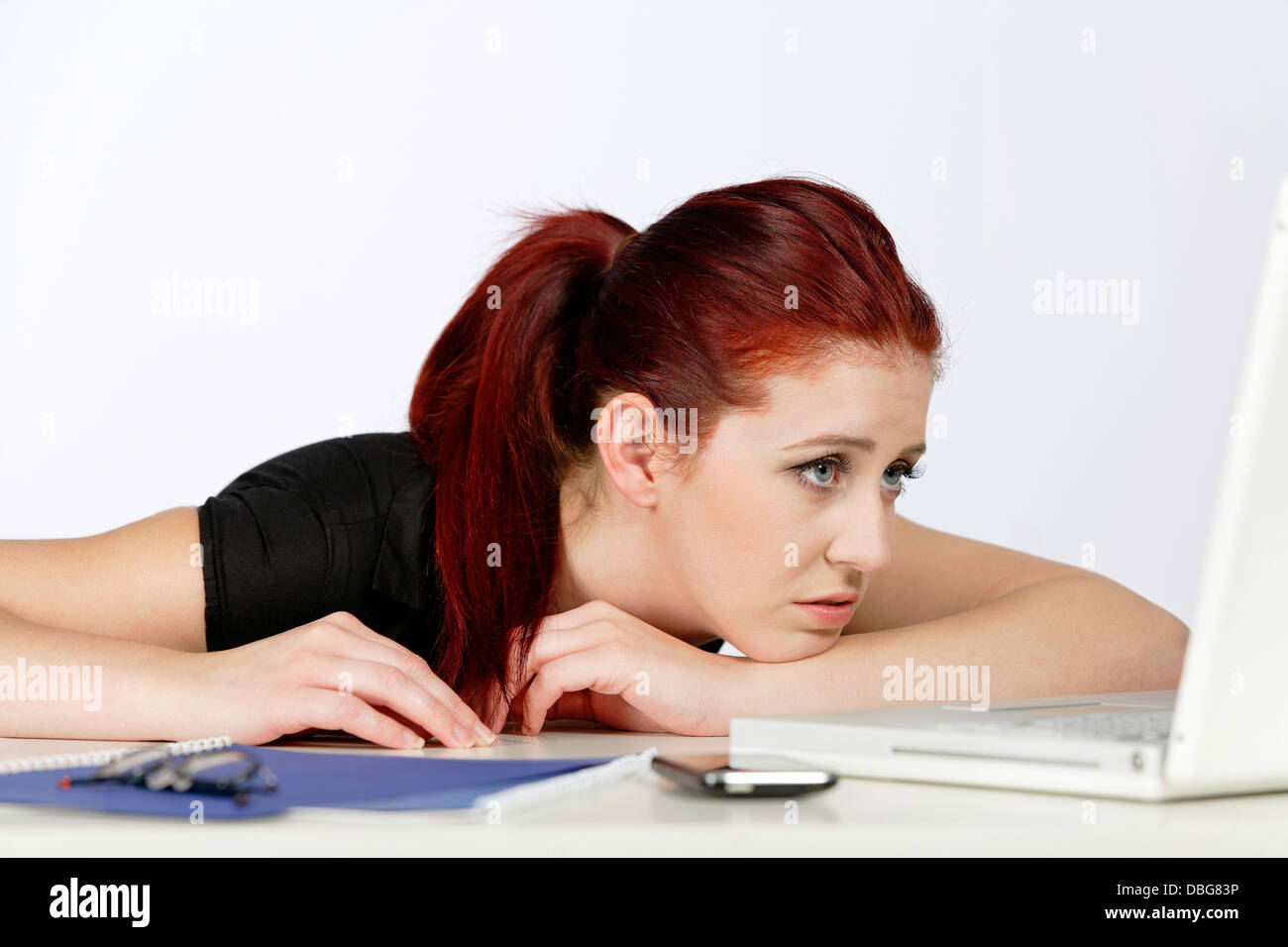 Woman concerned at work Stock Photo - Alamy