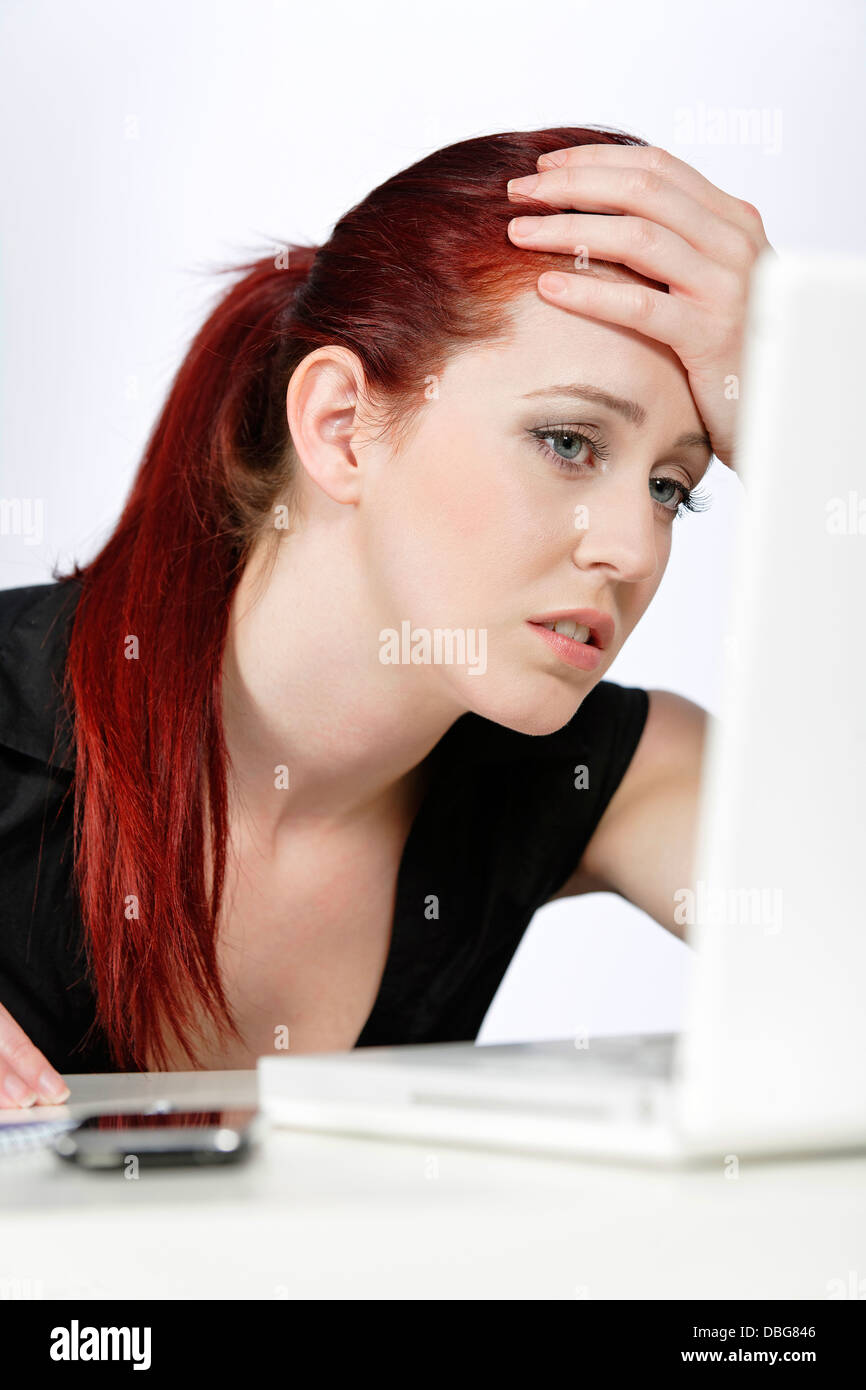 Woman concerned at work Stock Photo - Alamy