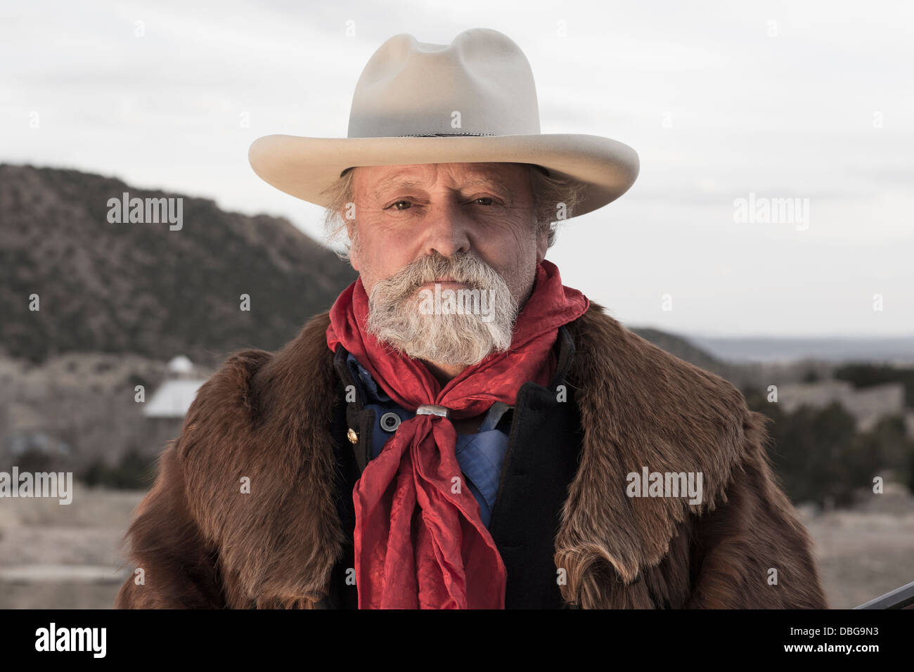 Caucasian man standing in dusty landscape Stock Photo - Alamy