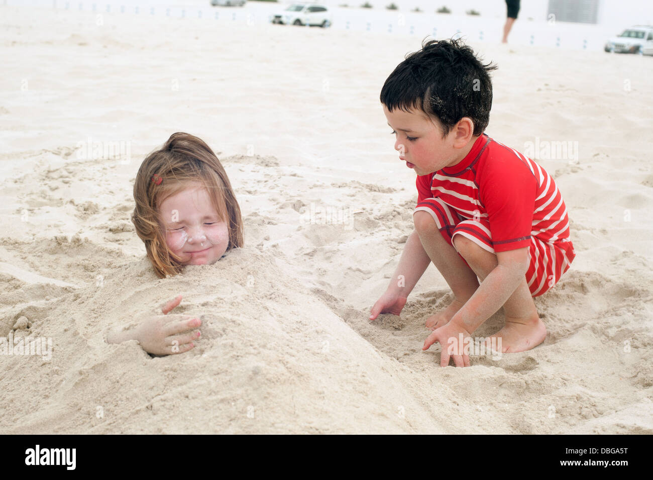 Children playing with sand hi-res stock photography and images - Alamy