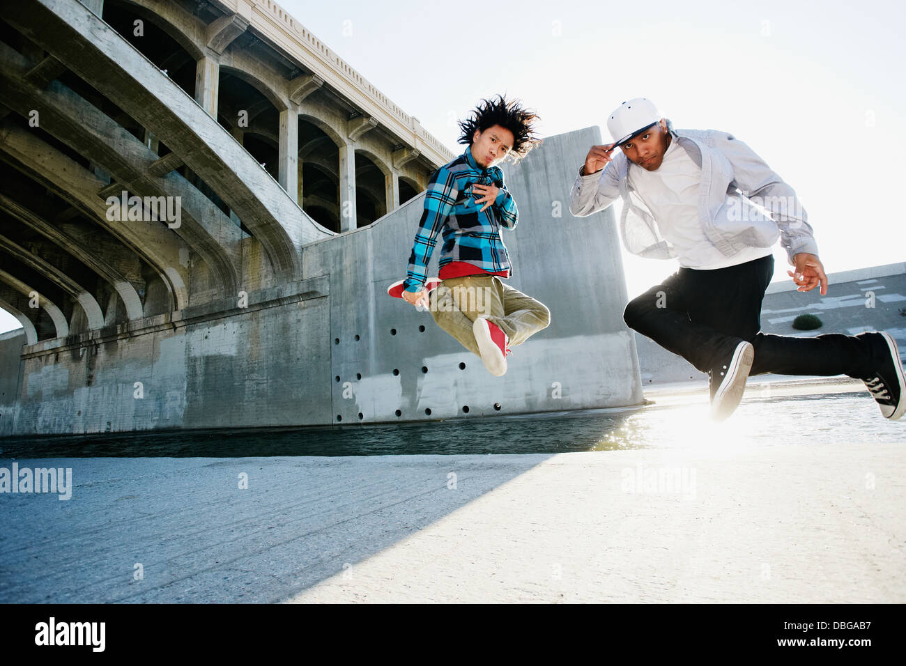 Men break dancing under overpass Stock Photo - Alamy
