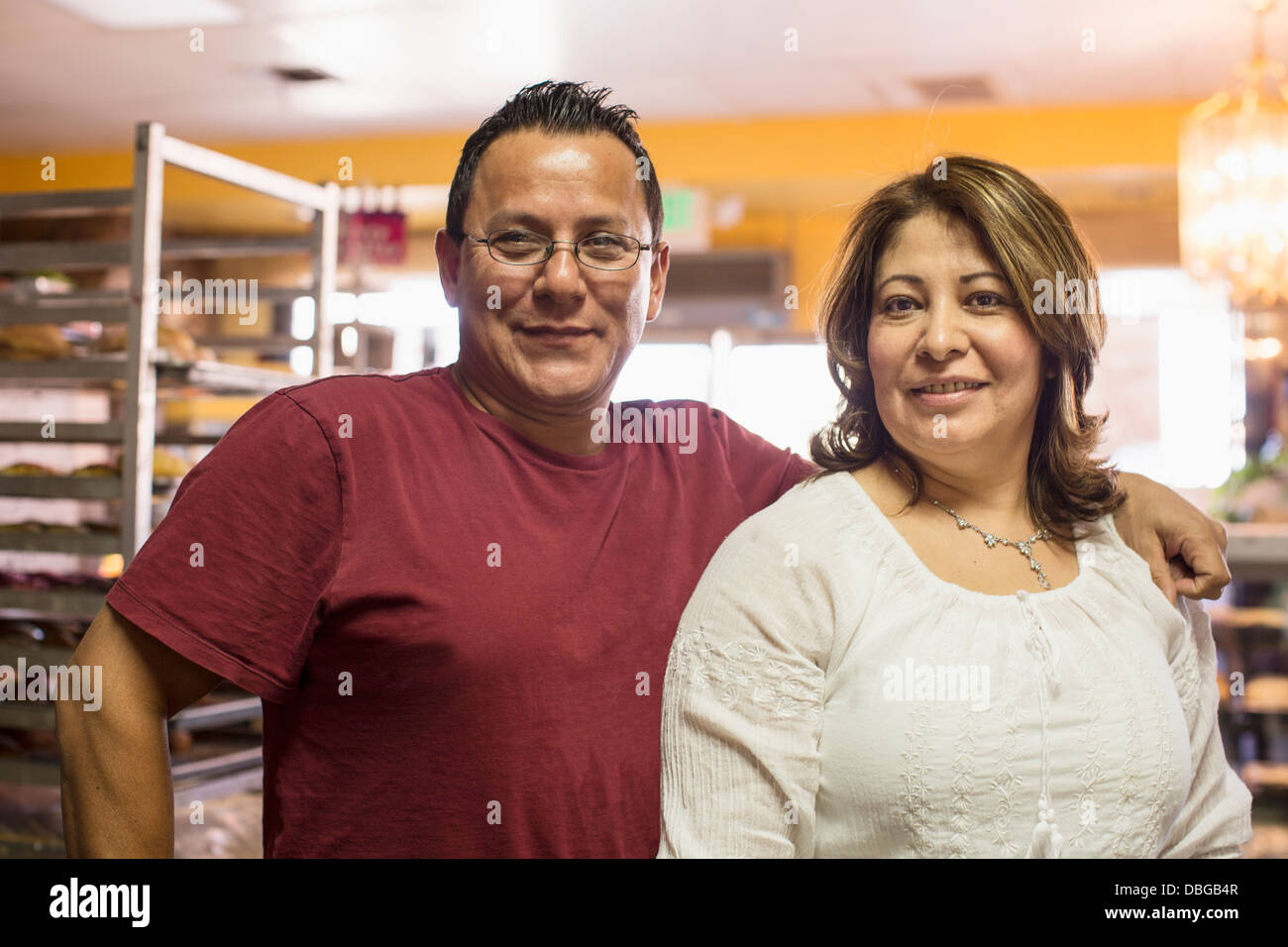 Hispanic bakers smiling in kitchen Stock Photo - Alamy