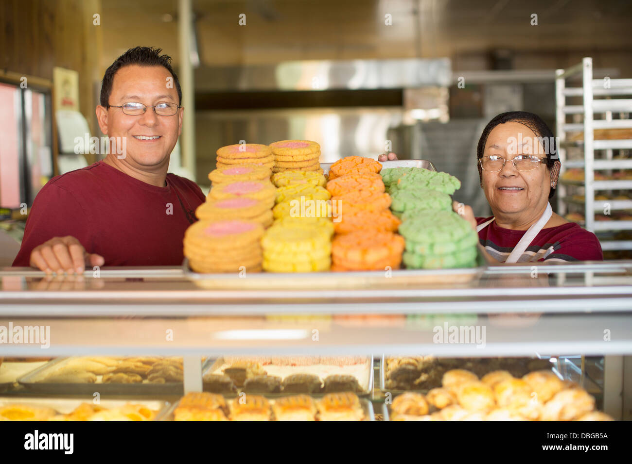 Hispanic bakers smiling in kitchen Stock Photo - Alamy