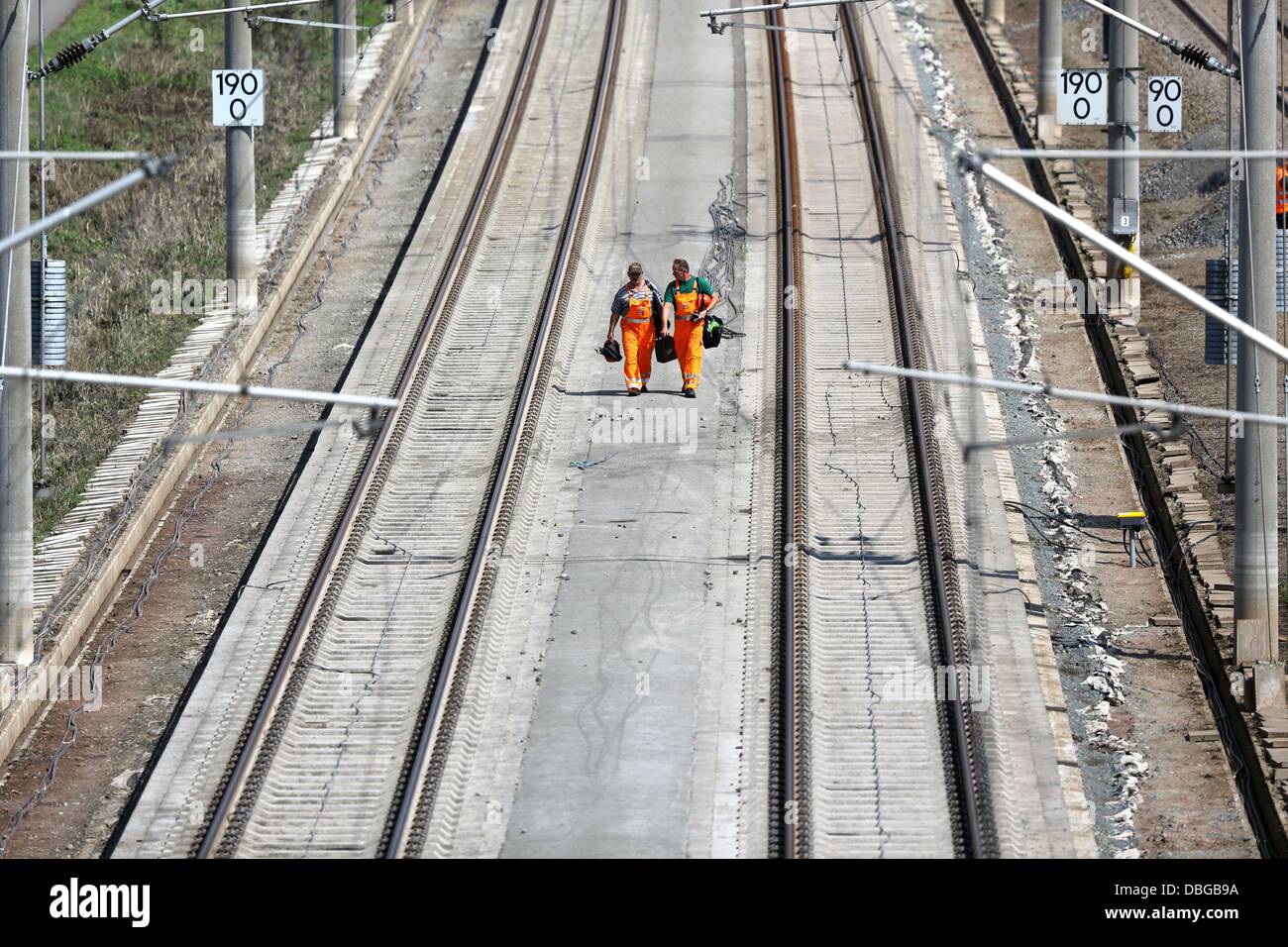 Railway workers repair the ICE highspeed railway line that was flooded ...