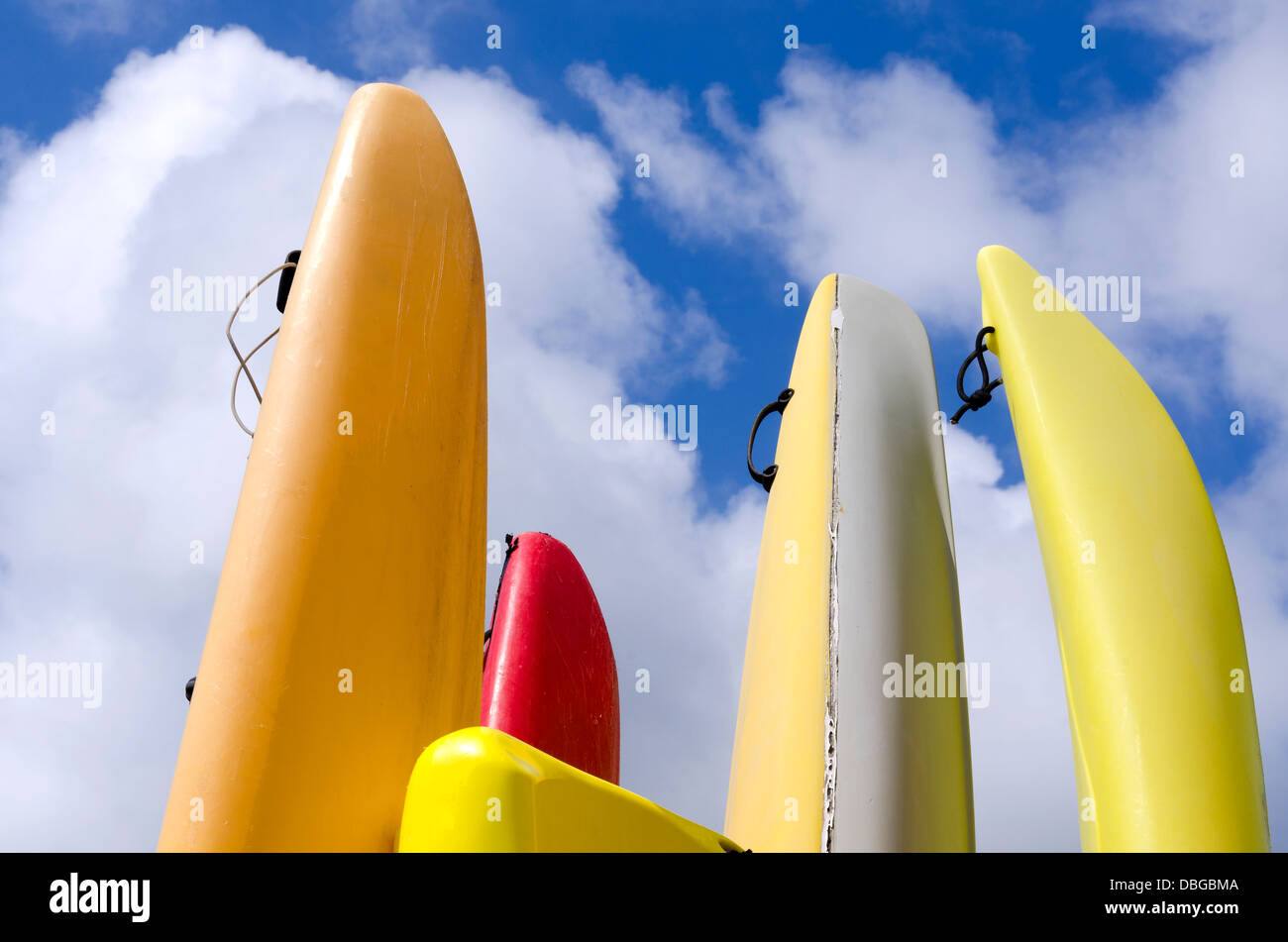 colorful canoes with cloudy sky Stock Photo - Alamy