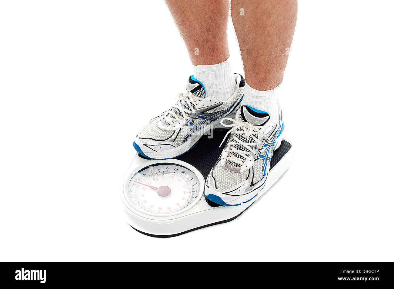 Male person standing on weighing scale. Extreme closeup Stock Photo - Alamy