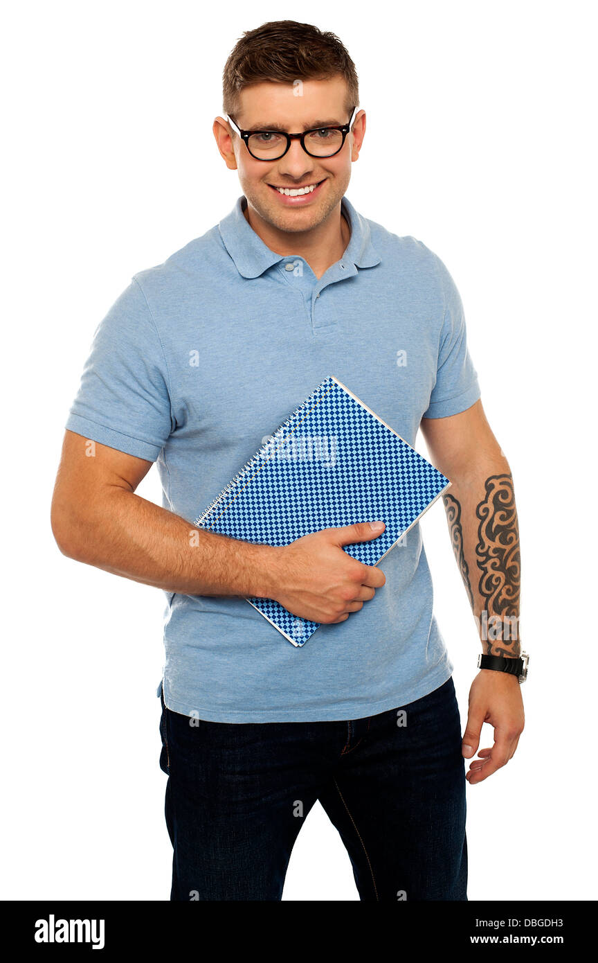 Modern college student holding notebook Stock Photo - Alamy