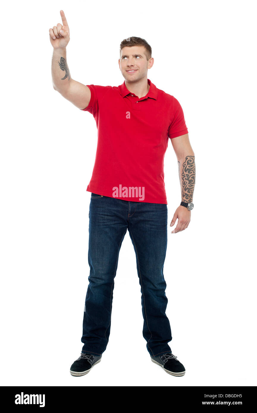 Handsome guy pointing upwards Stock Photo - Alamy