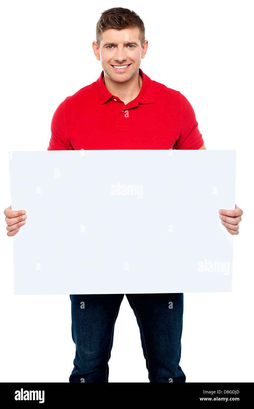 Casual guy presenting ad board Stock Photo - Alamy