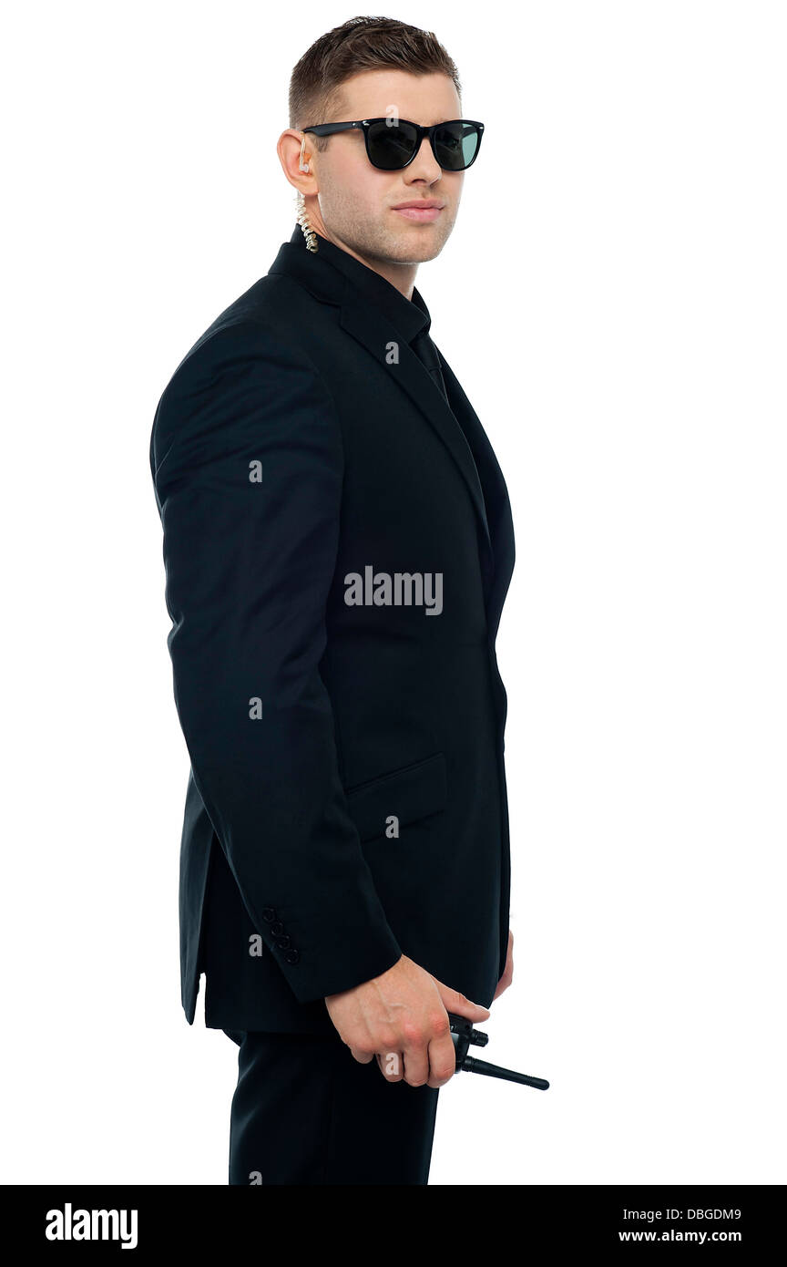 Smart young confident security officer posing Stock Photo - Alamy