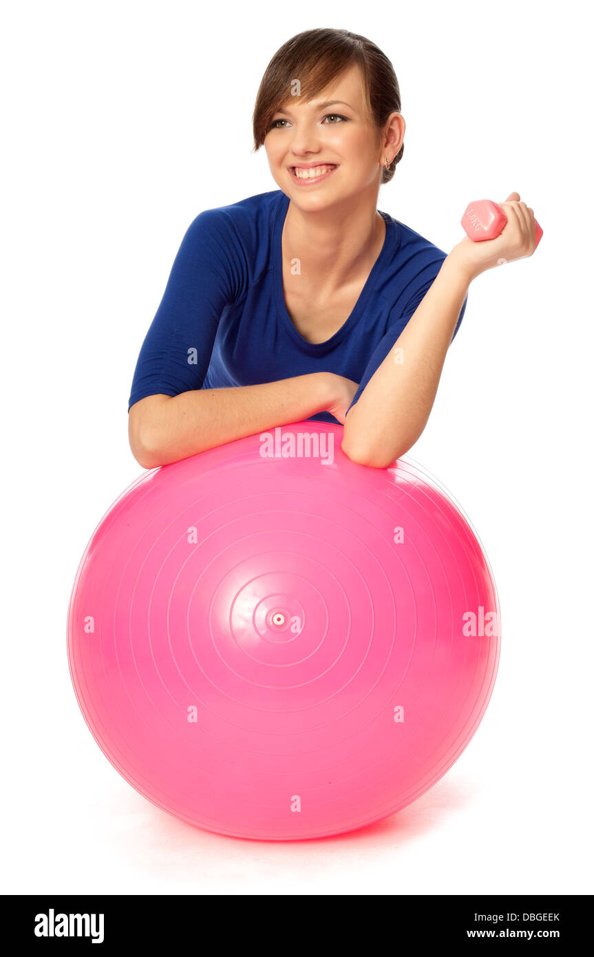 Exercises with dumbbells on a gymnastic ball Stock Photo - Alamy