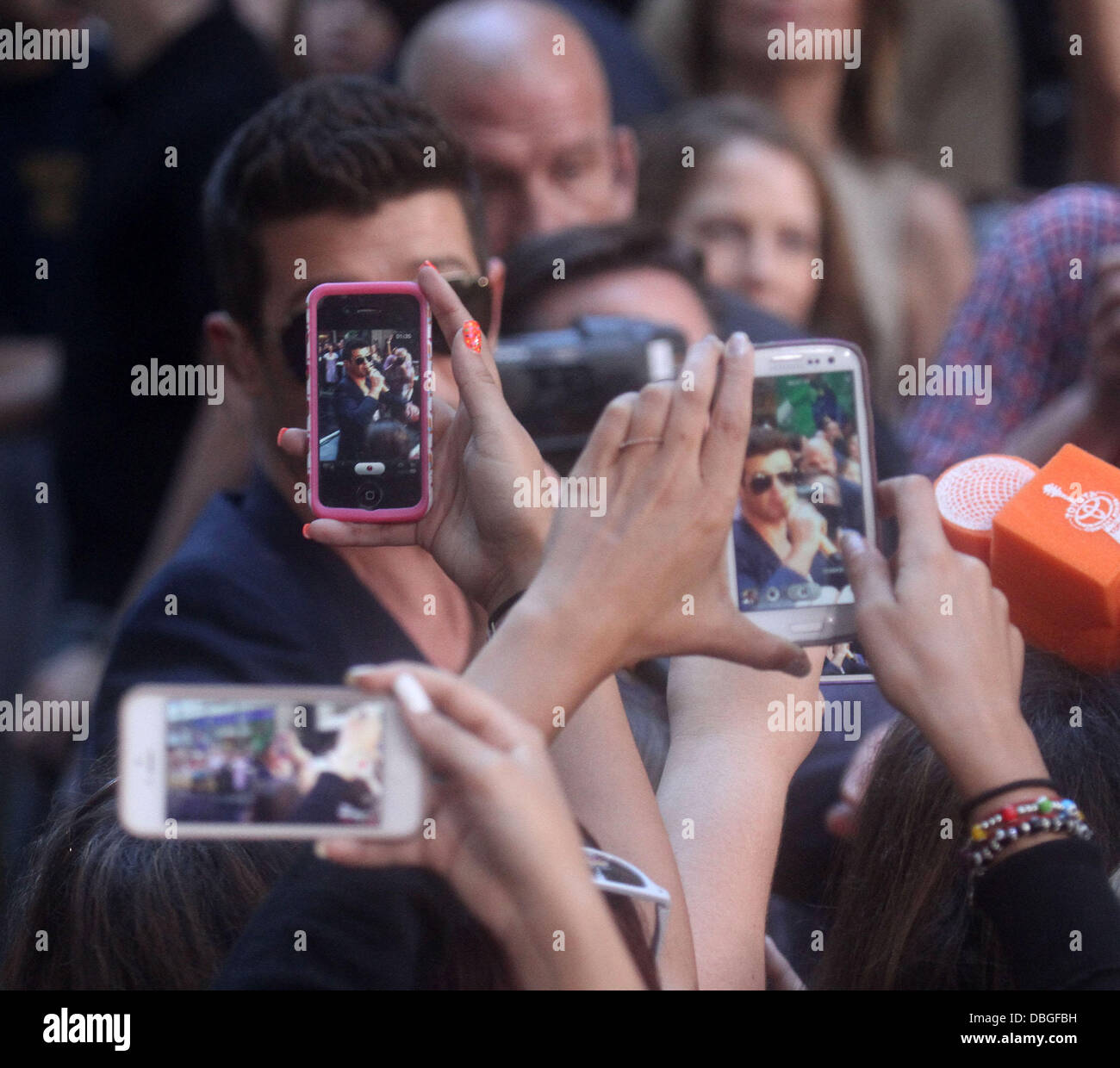 New York, New York, USA. 30th July, 2013. Fans use their smartphones to ...