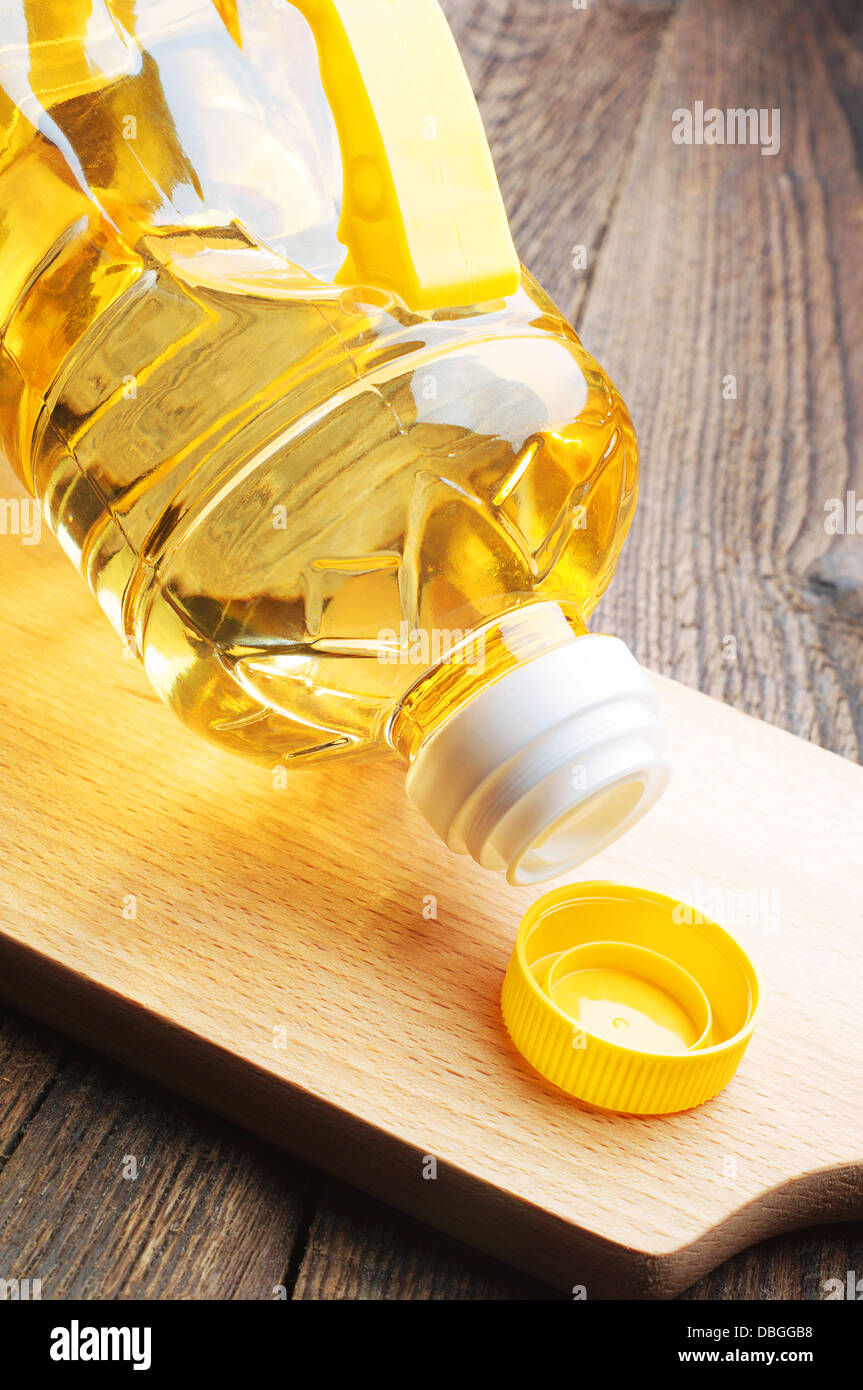 Vegetable oil in plastic bottle closeup on a cutting board Stock Photo ...