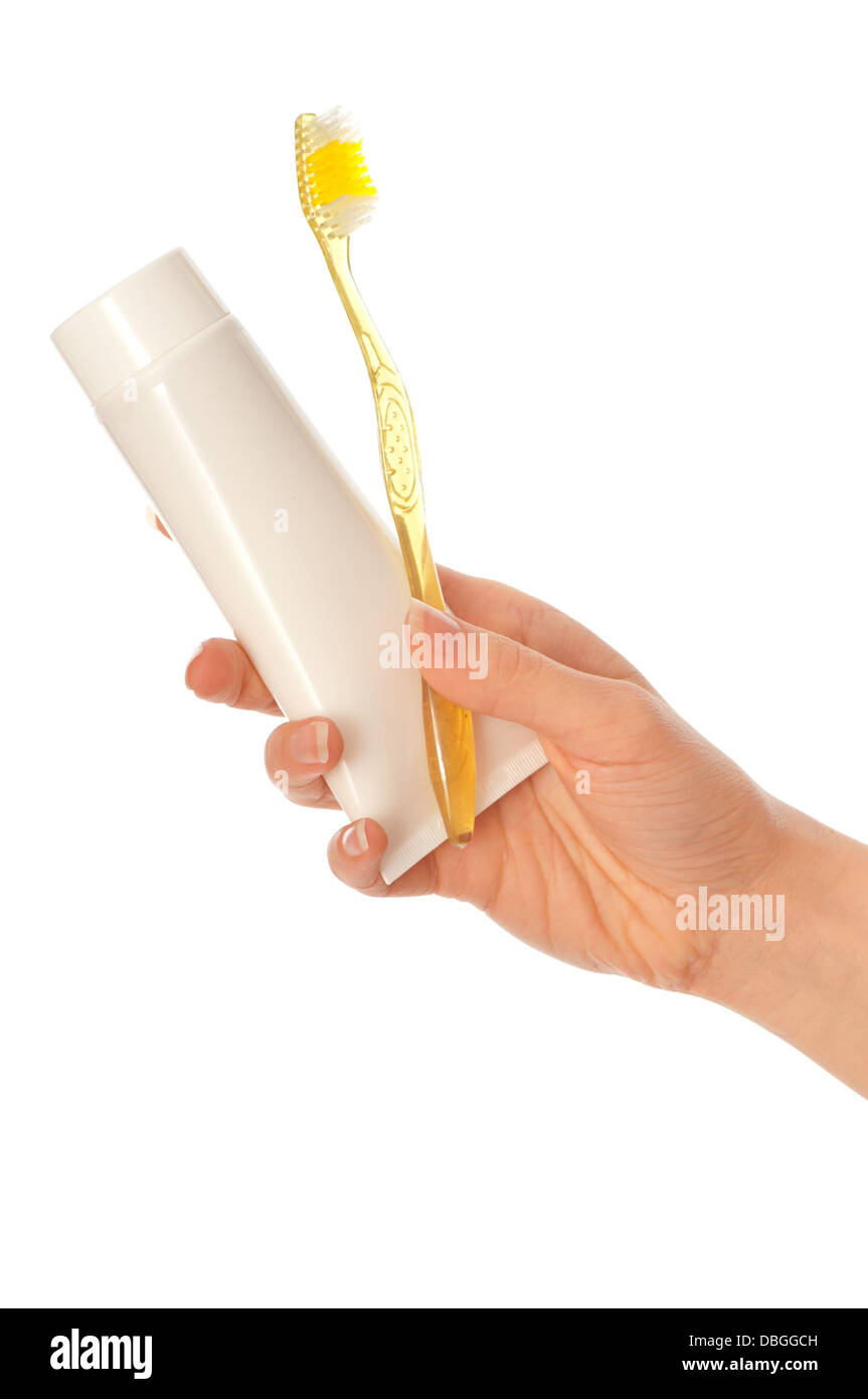 Toothpaste and yellow toothbrush Stock Photo - Alamy
