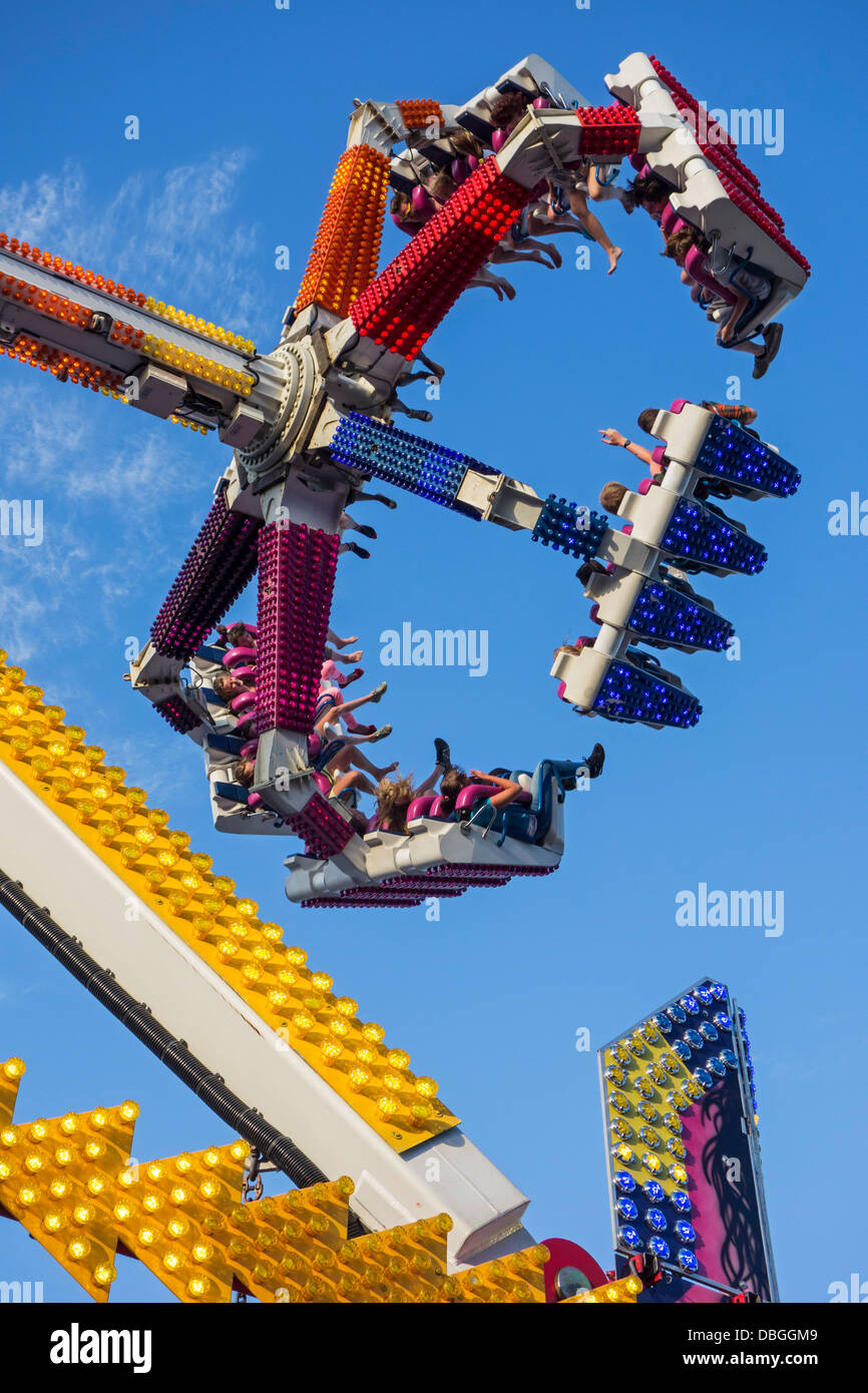Excited thrillseekers / thrill seekers having fun on fairground ...