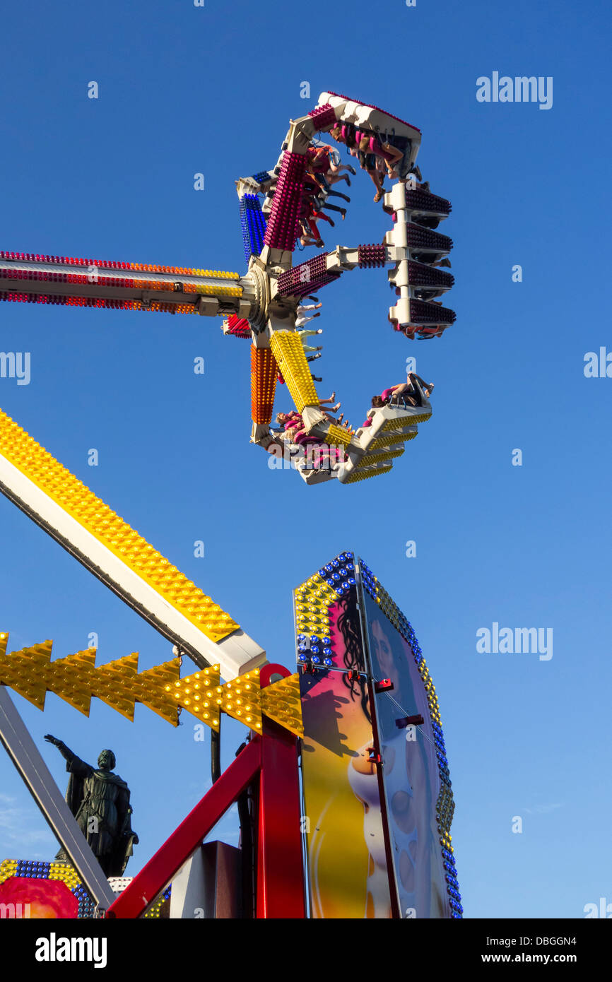 Excited thrillseekers / thrill seekers having fun on fairground ...