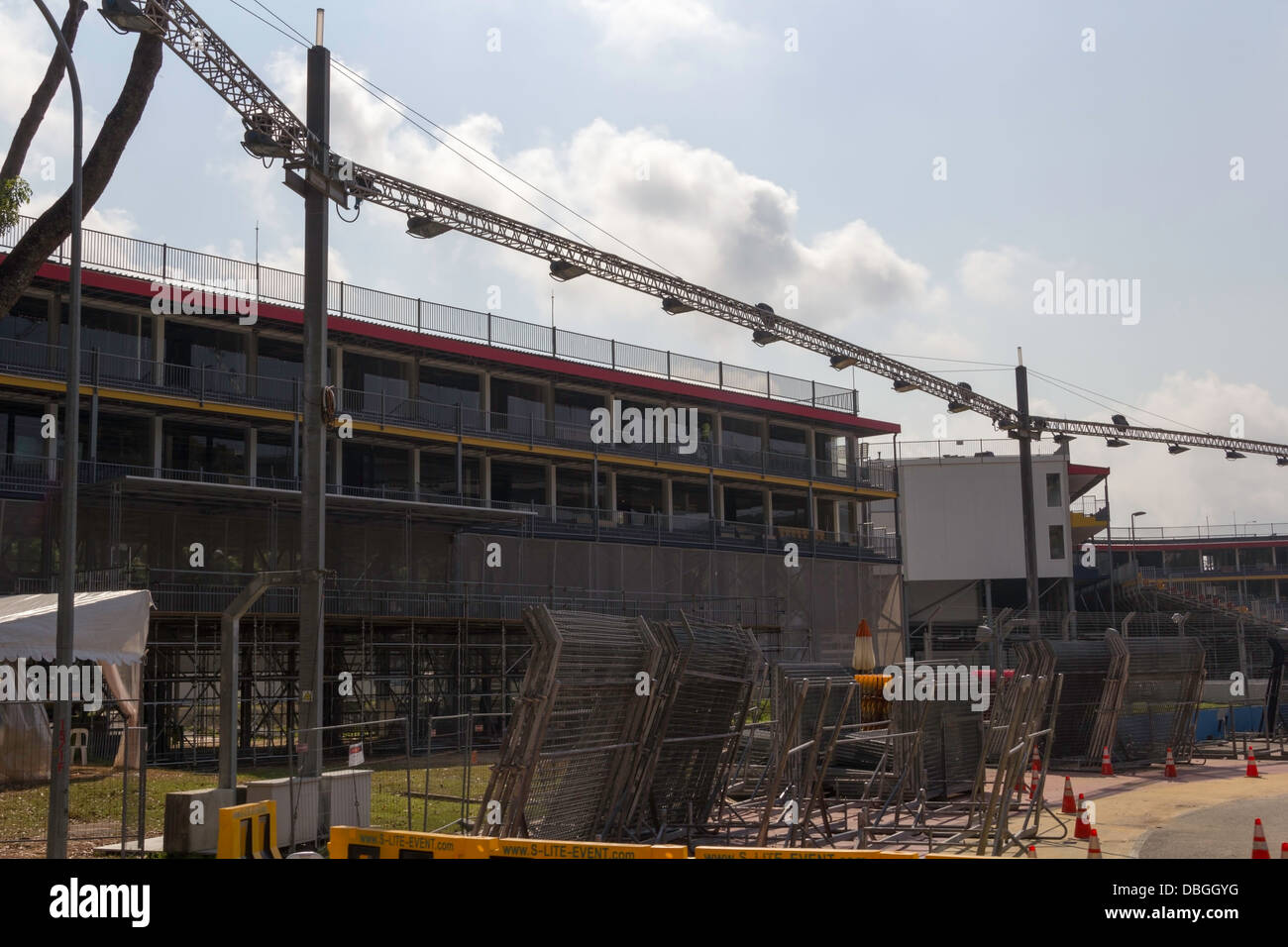 Setting up lighting support in front of stands for the Formula One race ...