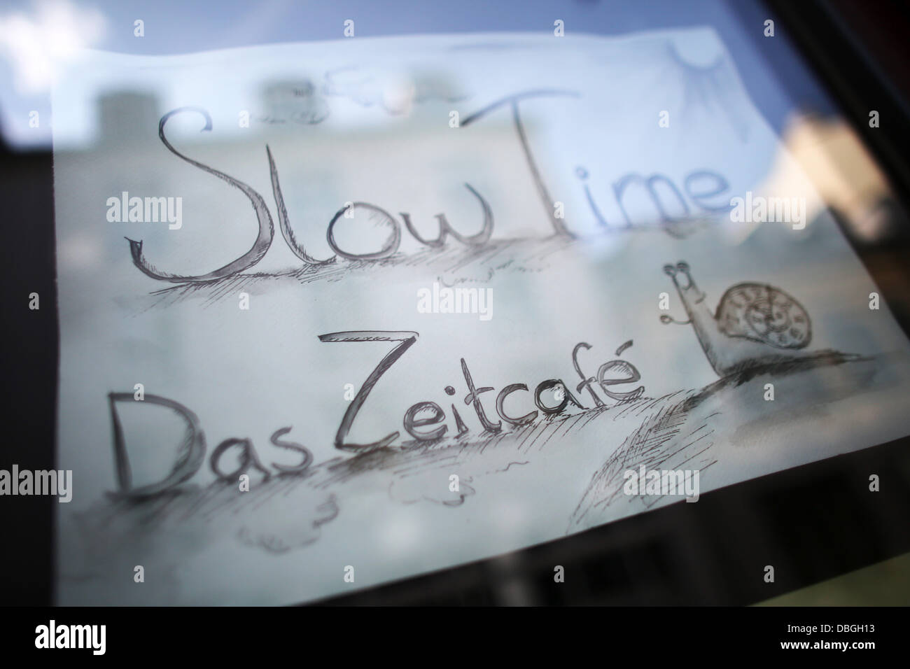 The cafe logo hangs in the window of "Slow Time" cafe in Wiesbaden ...