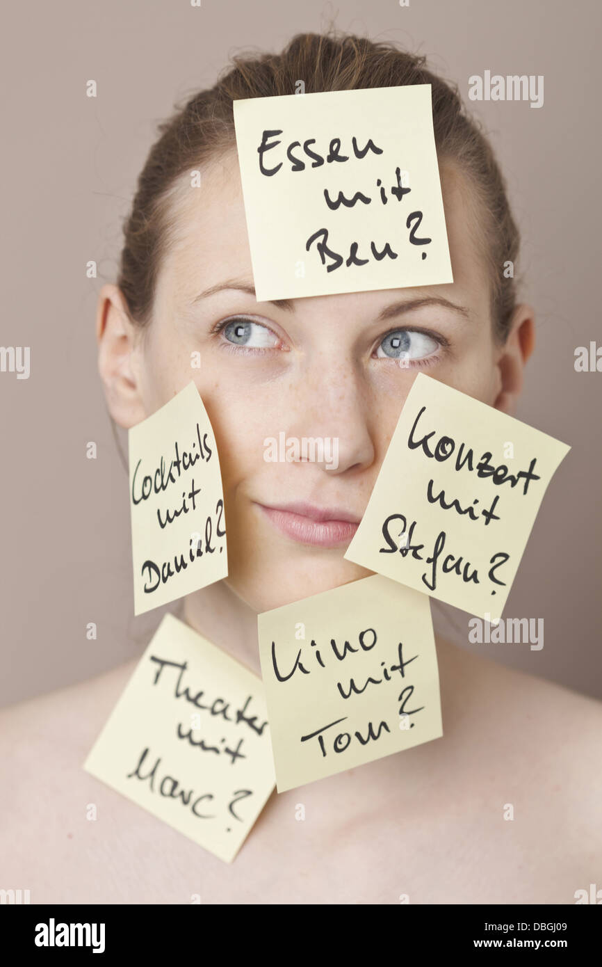 Young woman with different note it's in her face Stock Photo - Alamy