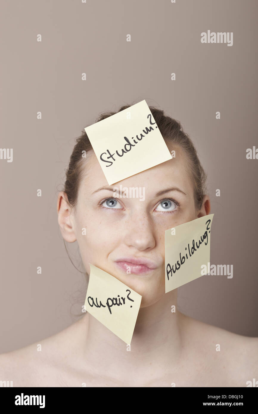 Young woman with different note it's in her face Stock Photo - Alamy