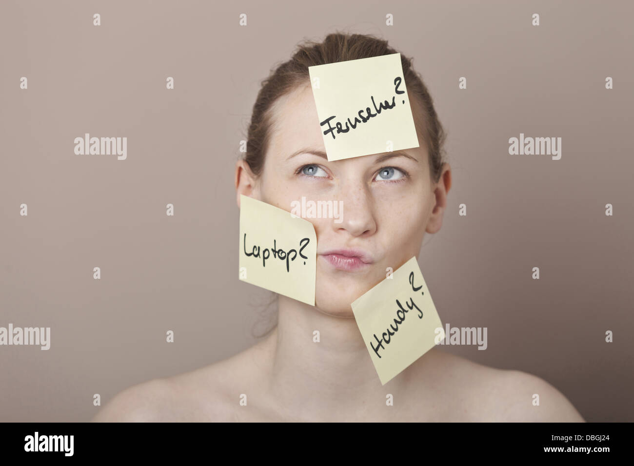 Young woman with different note it's in her face Stock Photo - Alamy