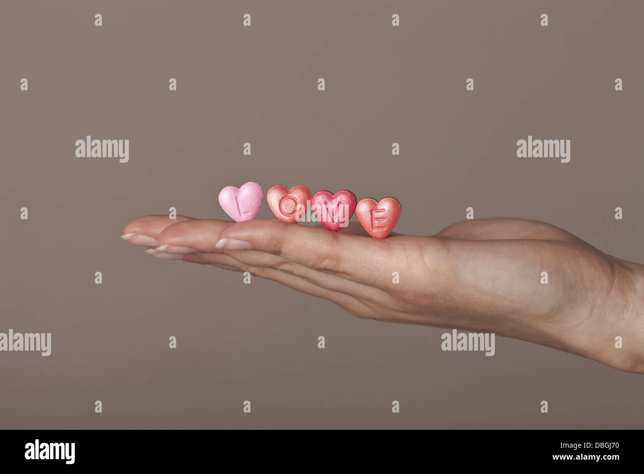 Woman's hand holding love letters Stock Photo - Alamy