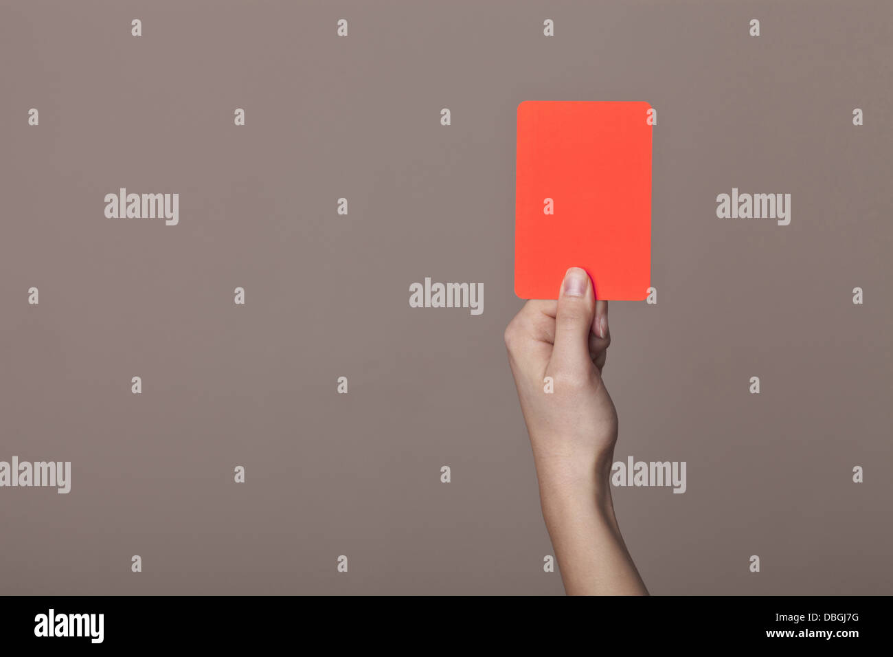 Woman's hand holding red card Stock Photo - Alamy
