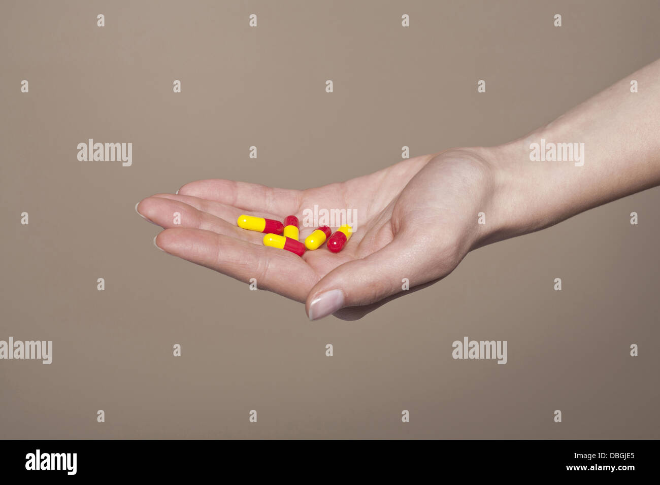 Woman's hands holding tablets Stock Photo - Alamy
