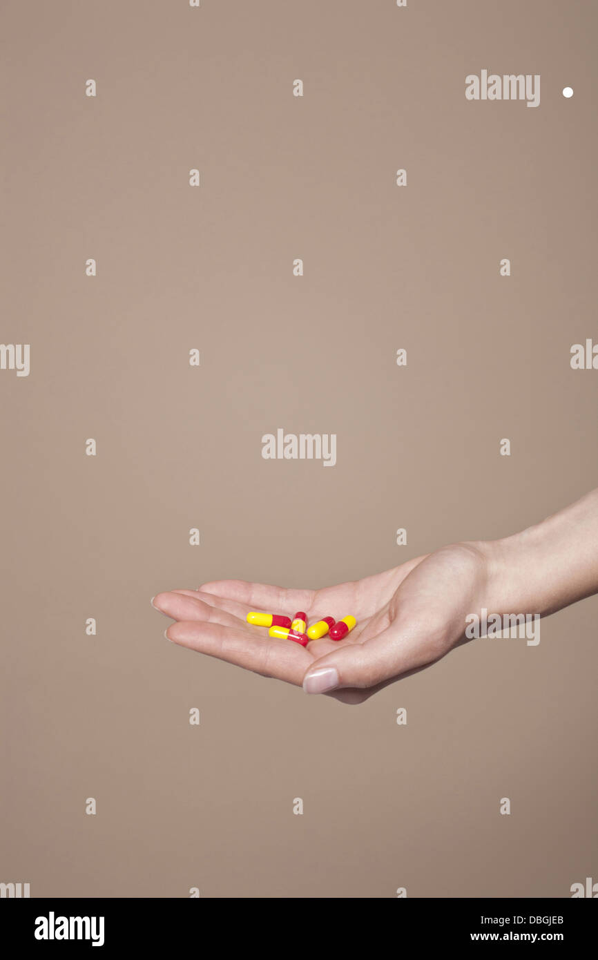 Woman's hands holding tablets Stock Photo - Alamy