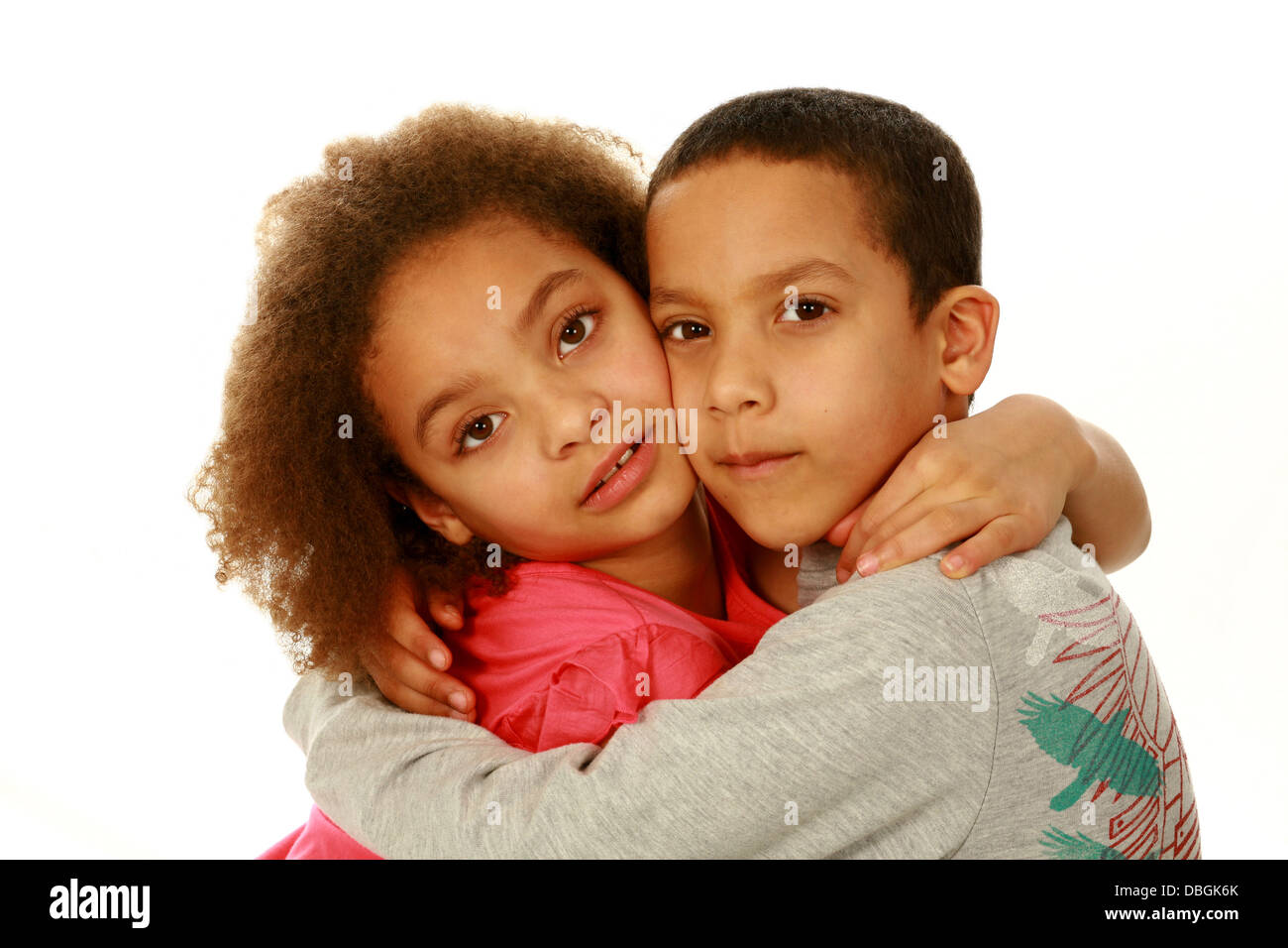 black children hugging with copy space Stock Photo - Alamy