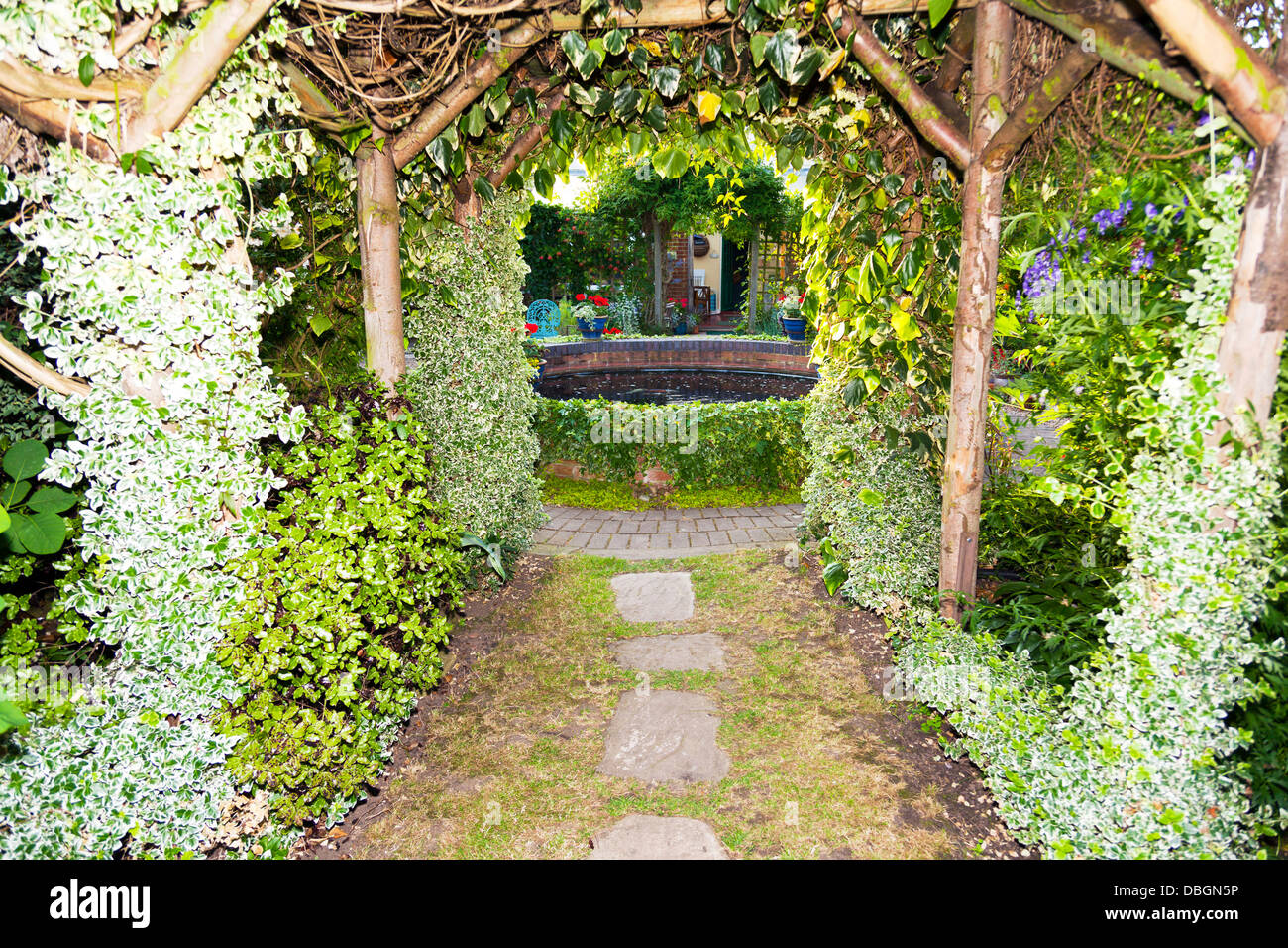 Typical English garden Arbour Arch archway Canopy tunnel leading in to ...