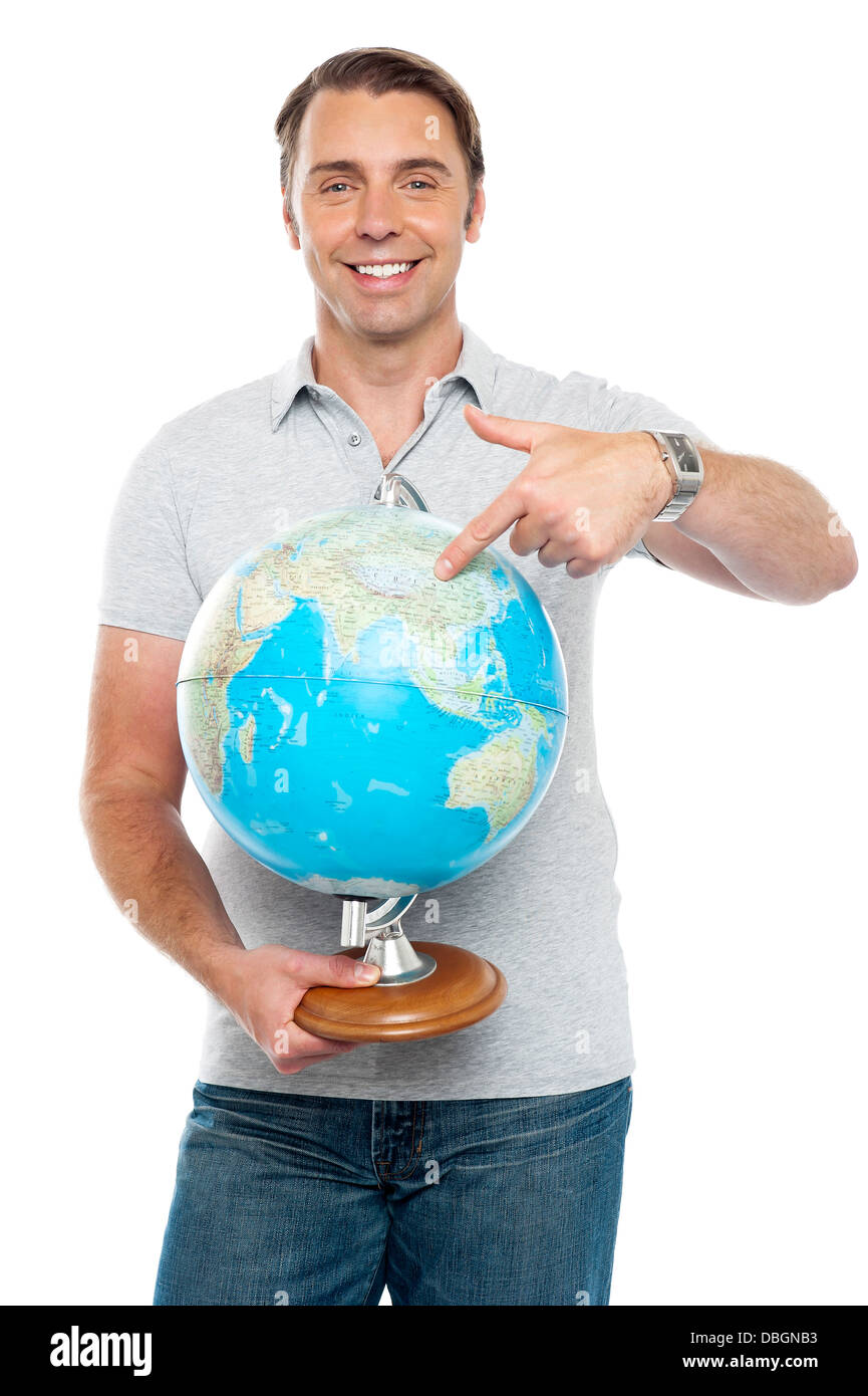 Isolated young man pointing at globe Stock Photo - Alamy Isolated young man pointing at globe Stock Photo - Alamy
