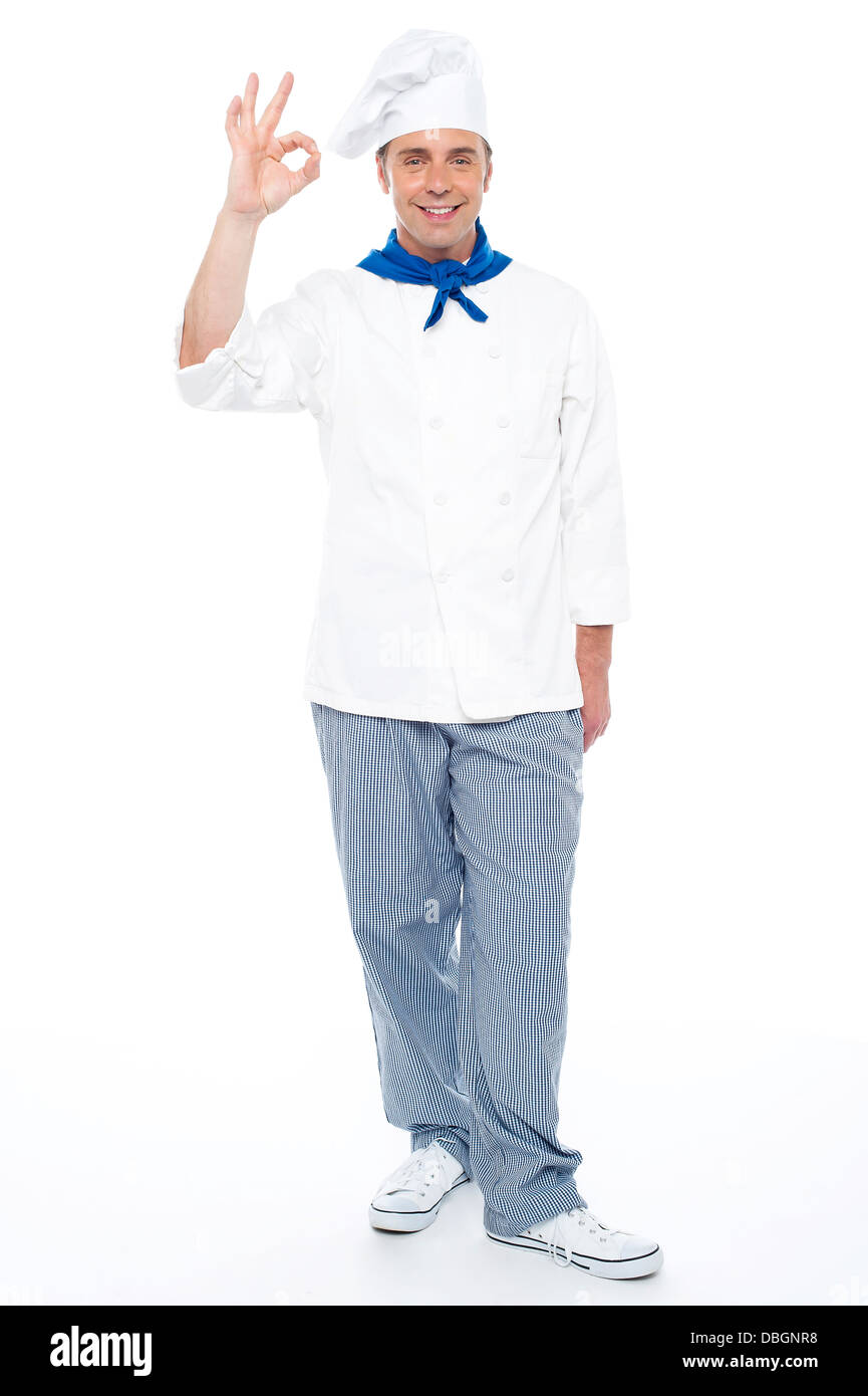 Full length portrait of chef showing okay sign Stock Photo - Alamy