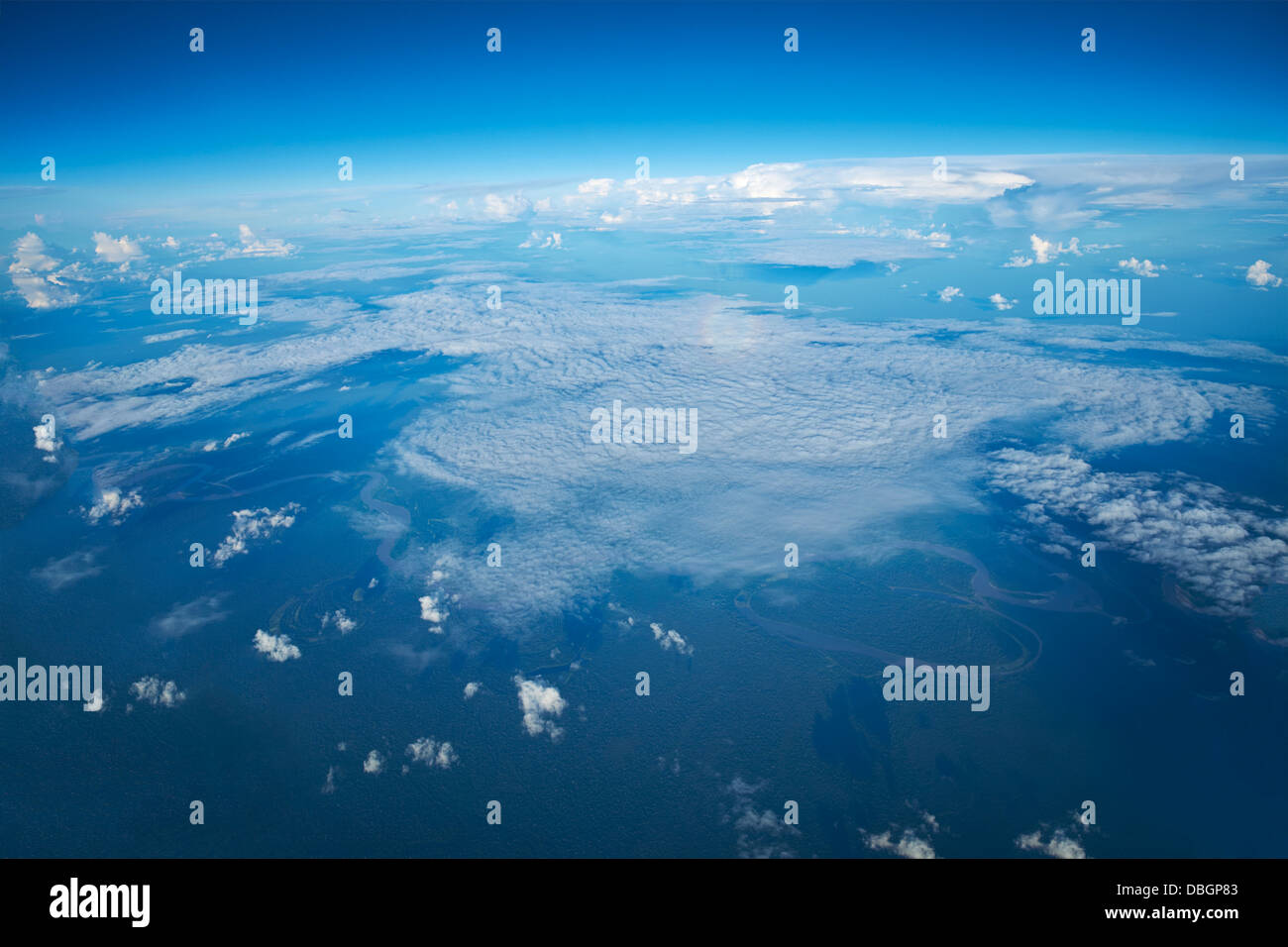 Looking down through the clouds to planet earth Stock Photo - Alamy