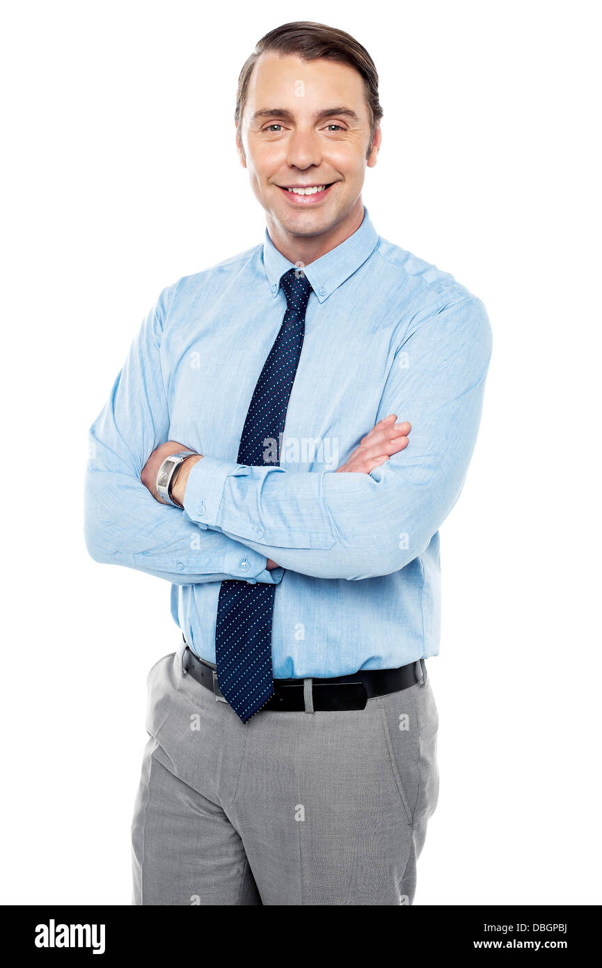Smiling young team leader keeping his arms folded Stock Photo - Alamy