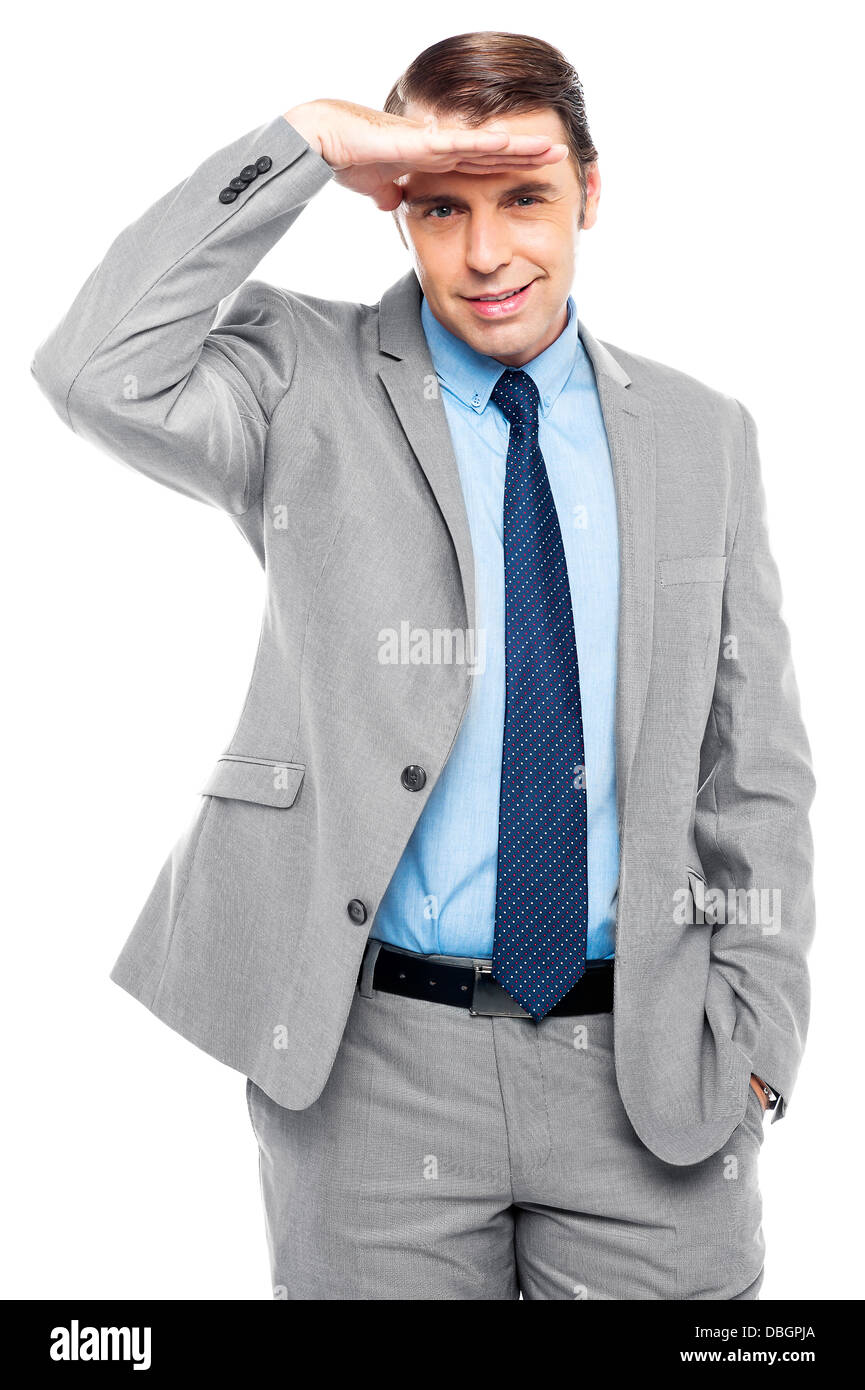 Handsome businessman watching something closely Stock Photo - Alamy