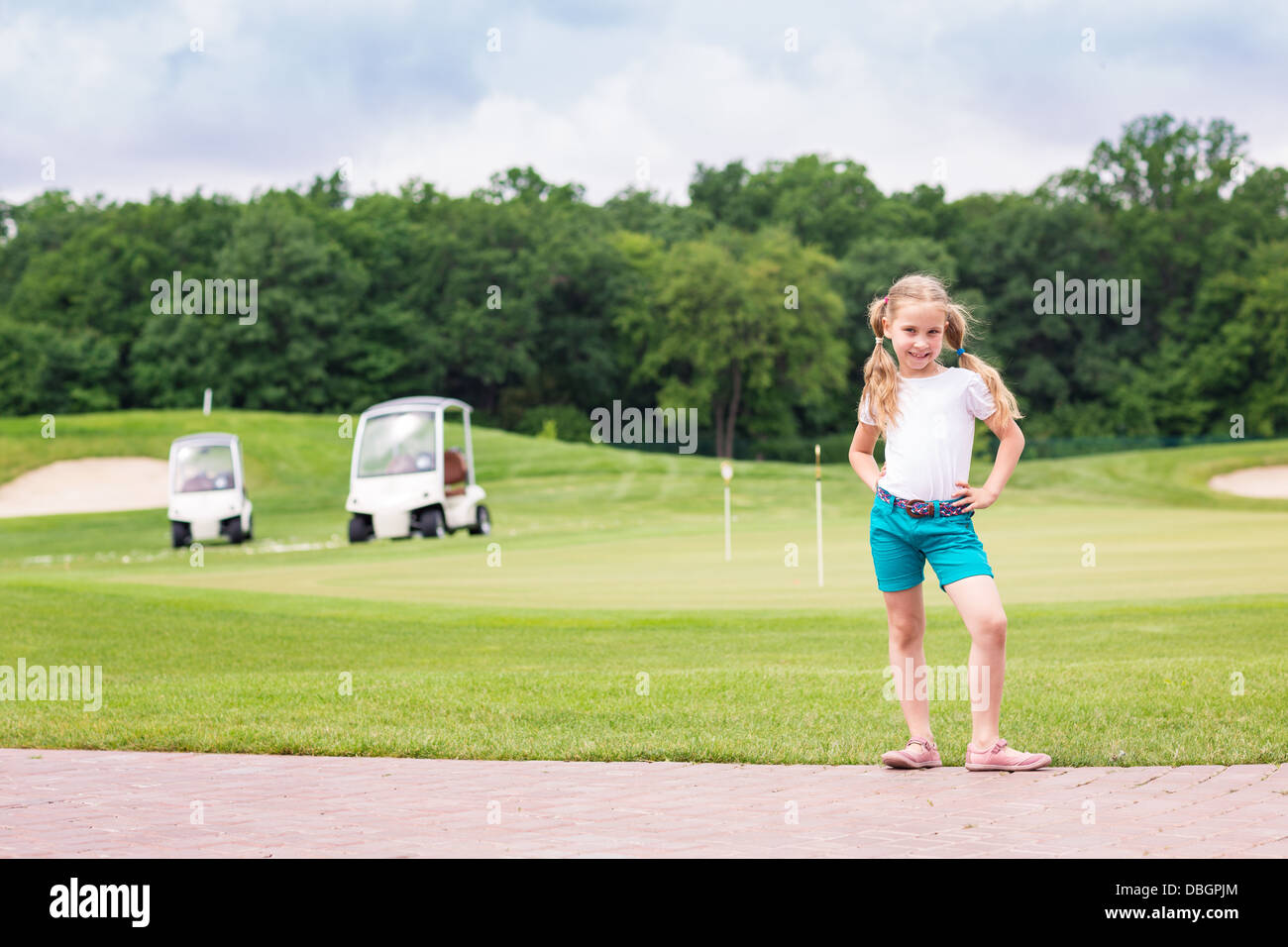 Cute little sportive gilr on the golf course Stock Photo - Alamy